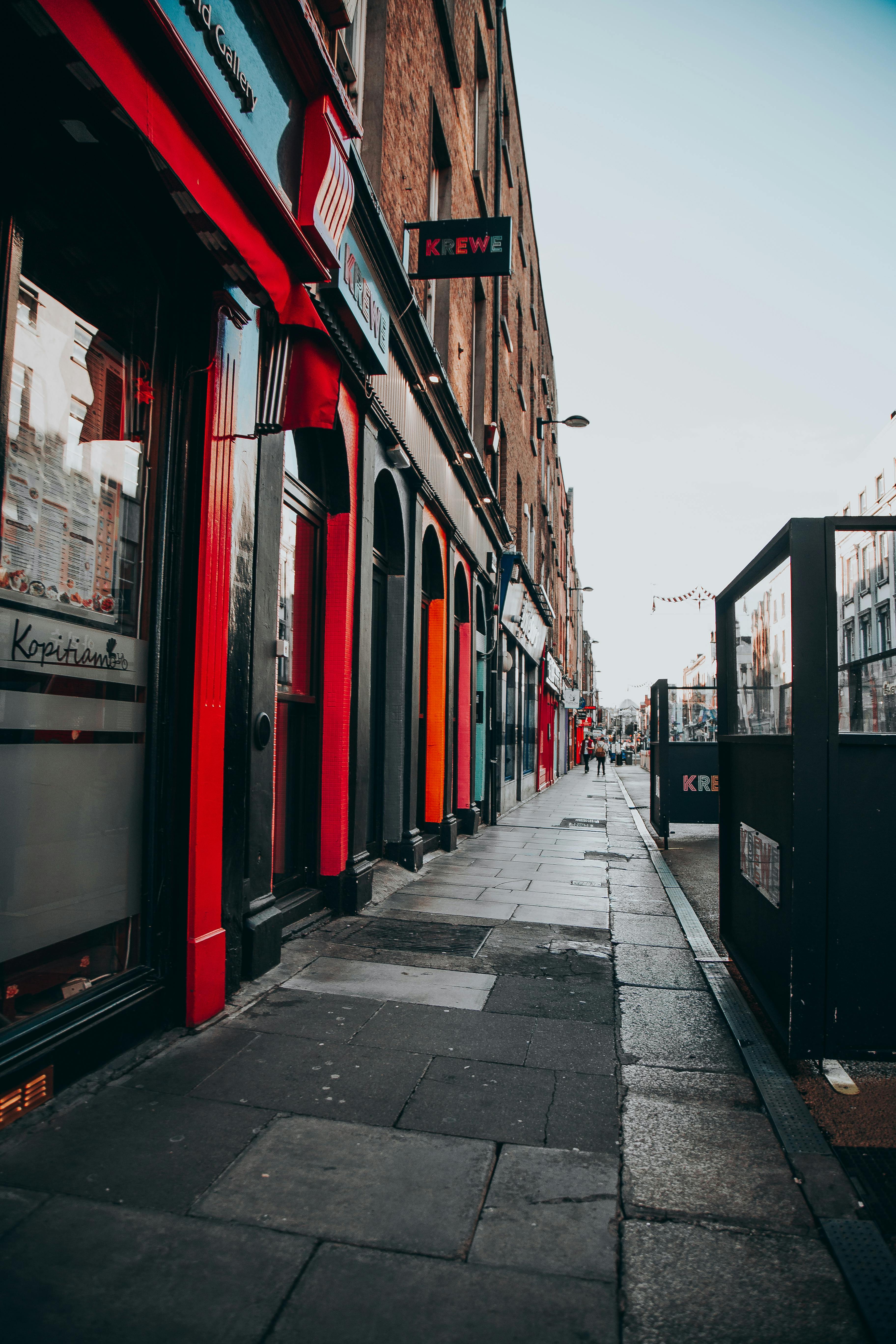 Sidewalk Beside a Brick Building · Free Stock Photo