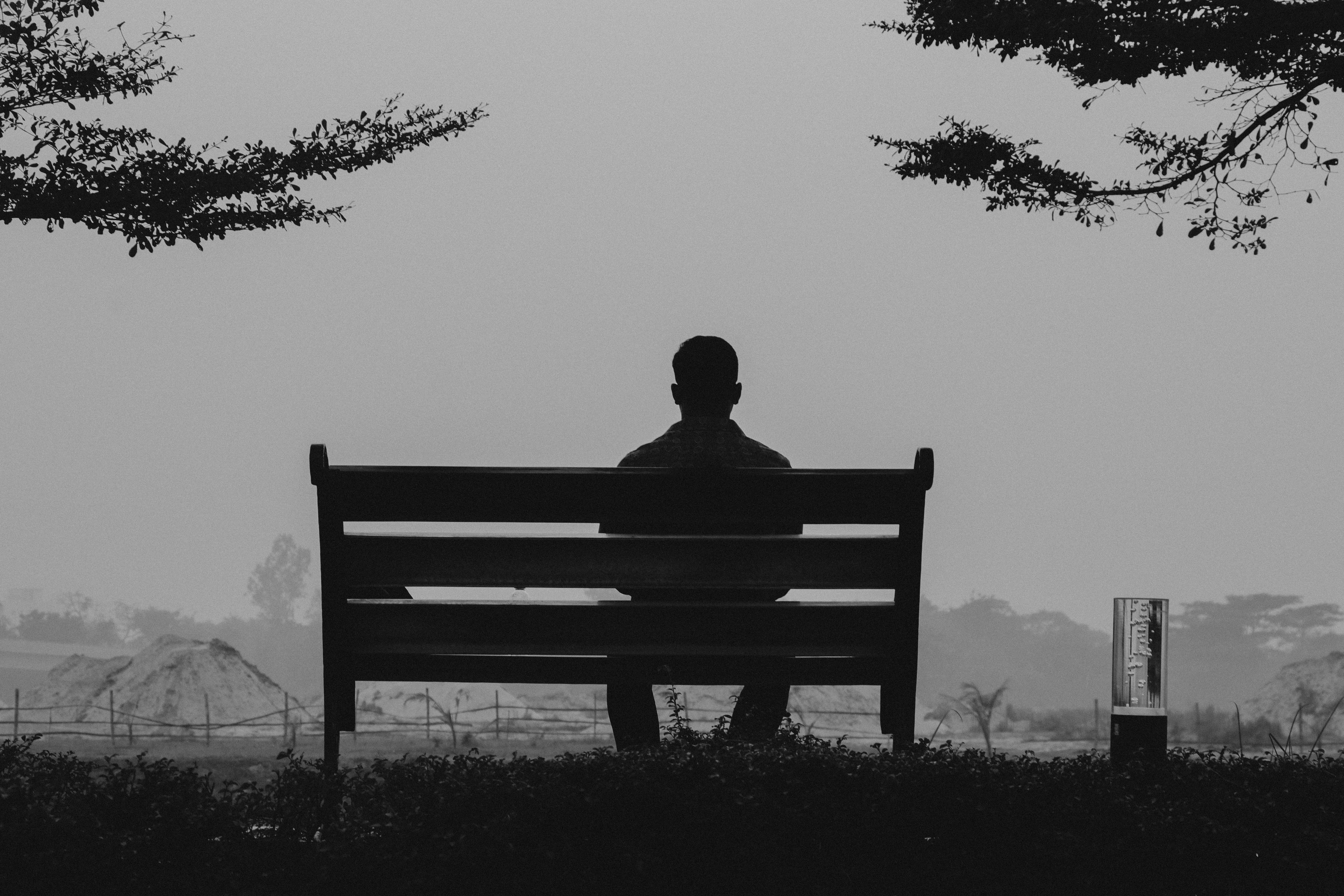 Lonely man sitting on bench · Free Stock Photo