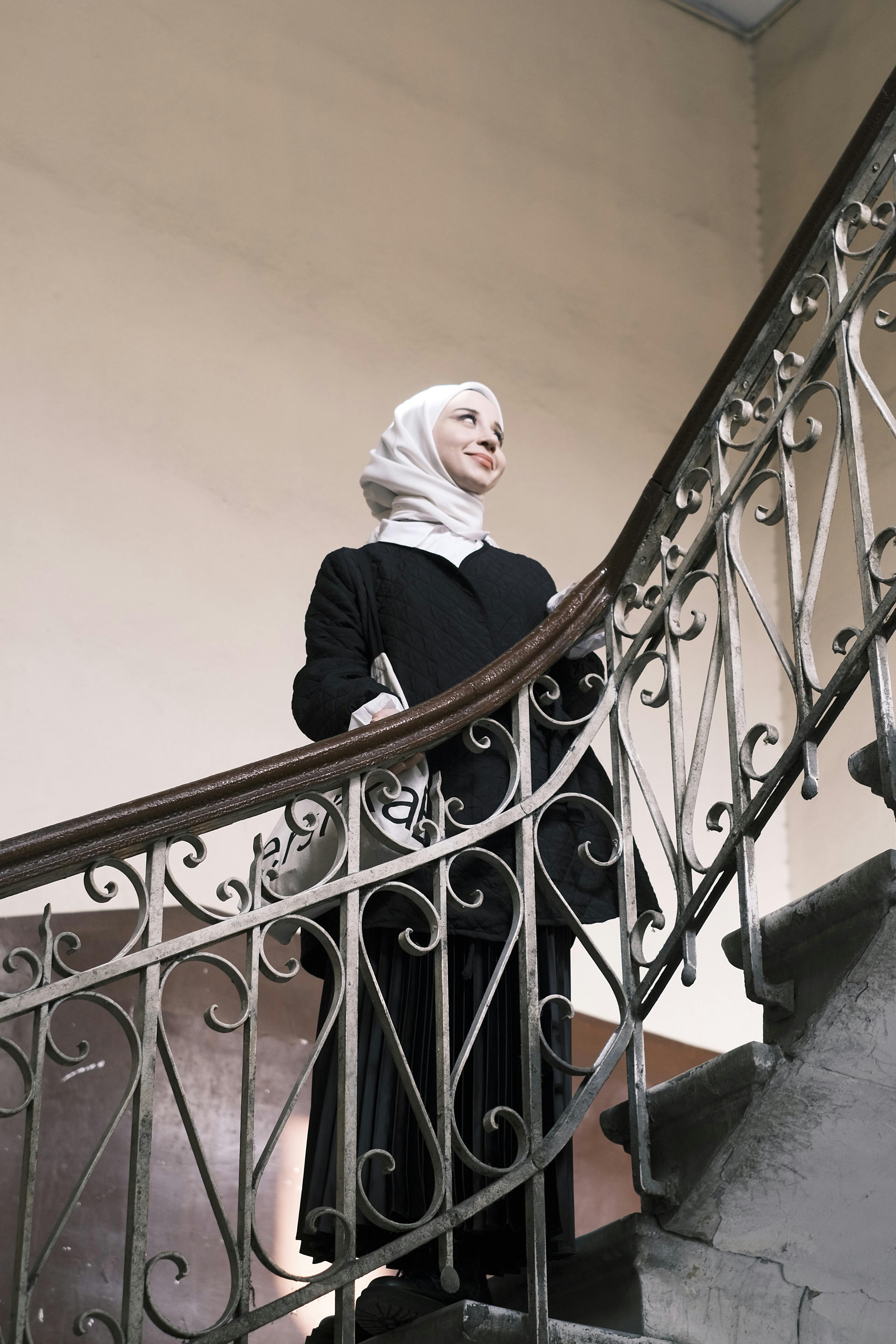 Smiling Woman on Staircase · Free Stock Photo