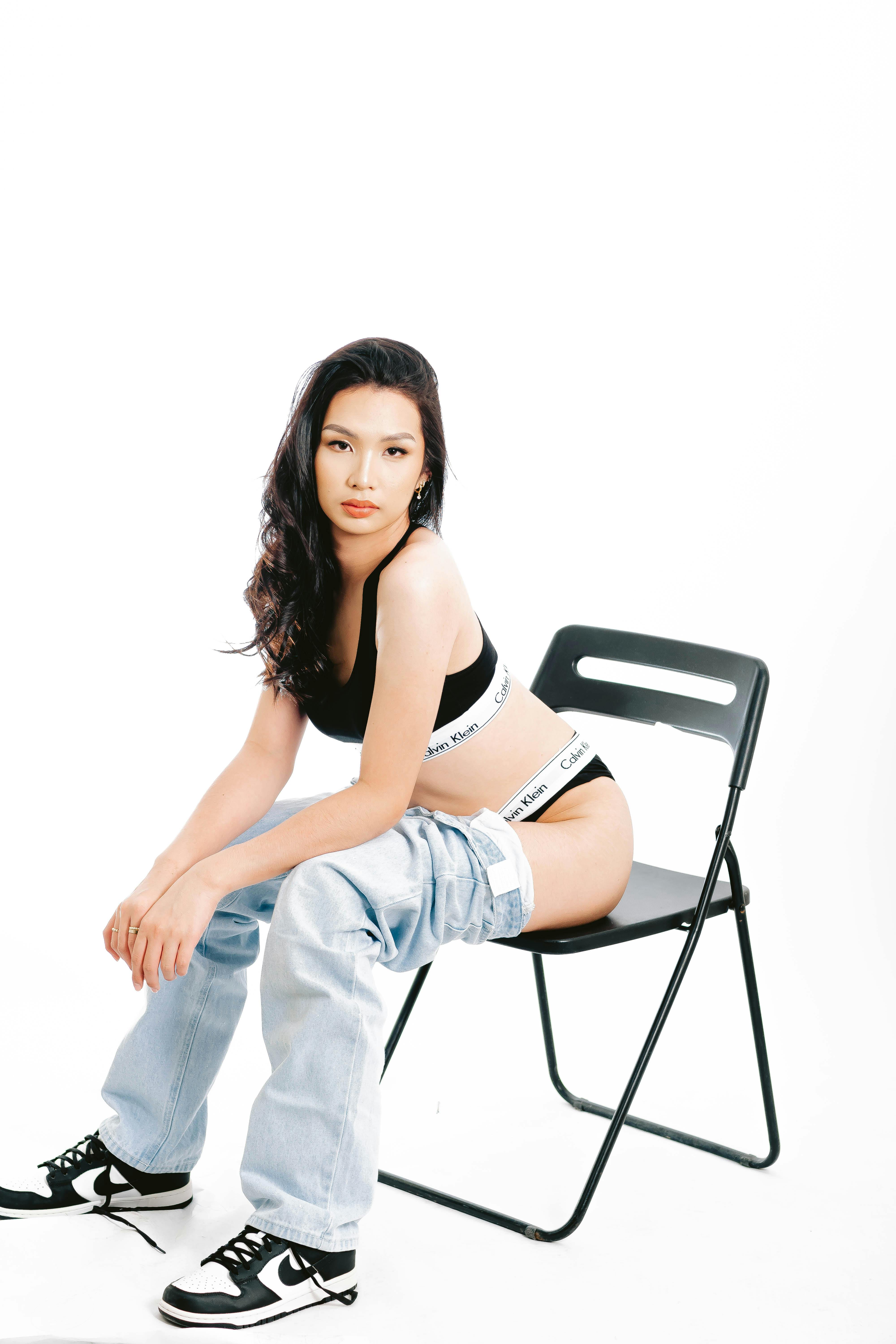 Sitting on Chair Woman in Underwear and Jeans · Free Stock Photo