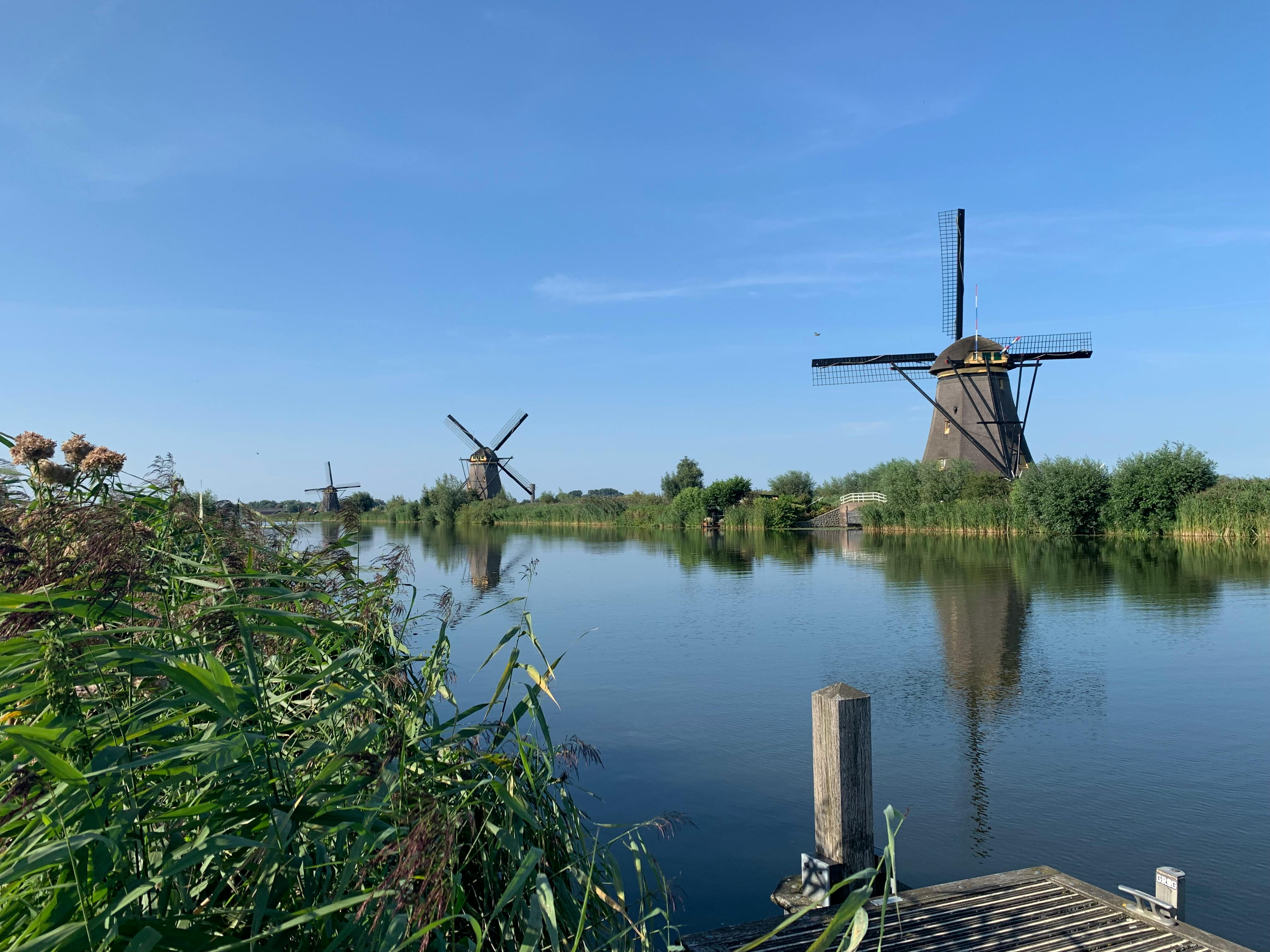 Windmills by the River in Kinderdijk, the Netherlands · Free Stock Photo