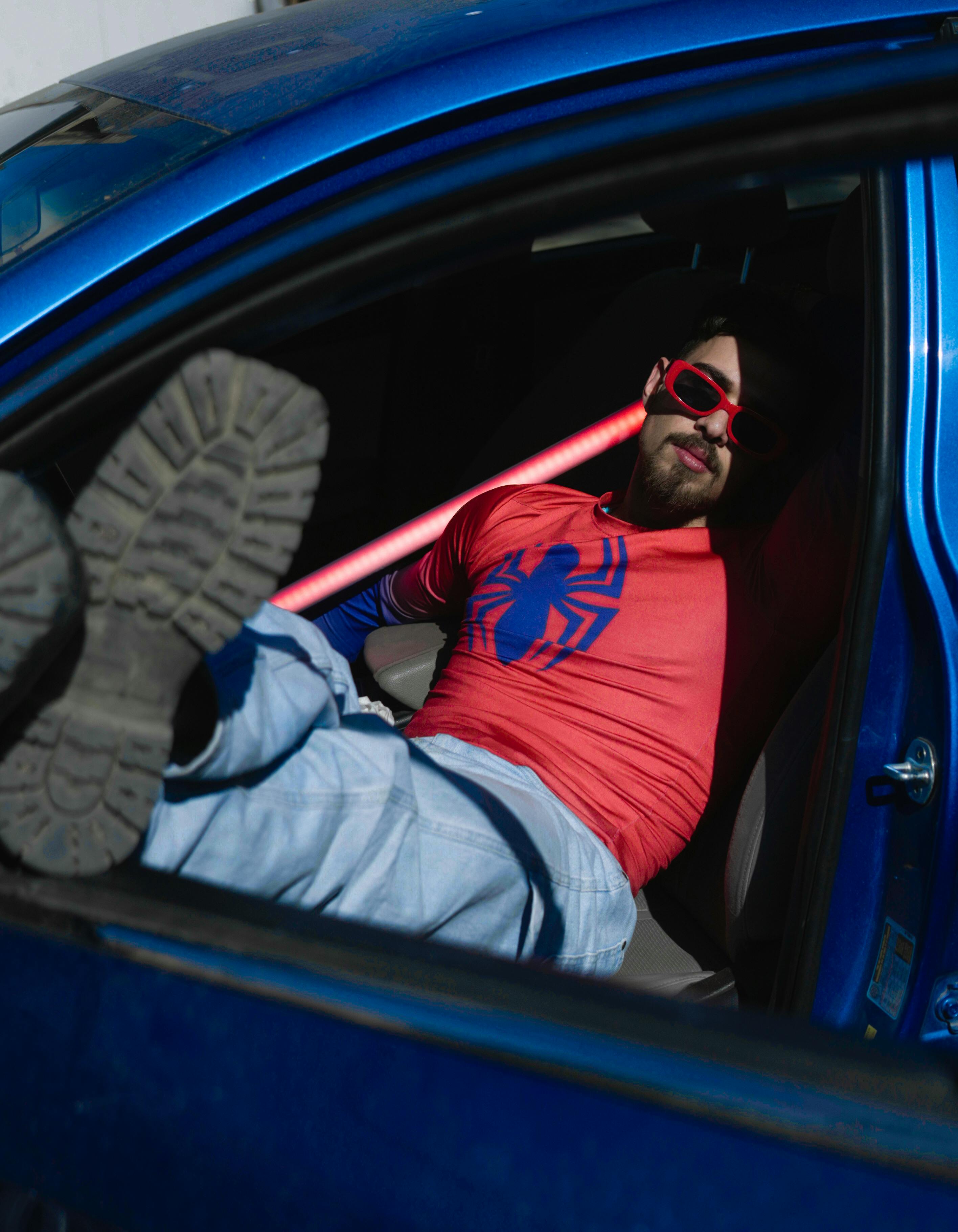 Man Lying Down in Car · Free Stock Photo