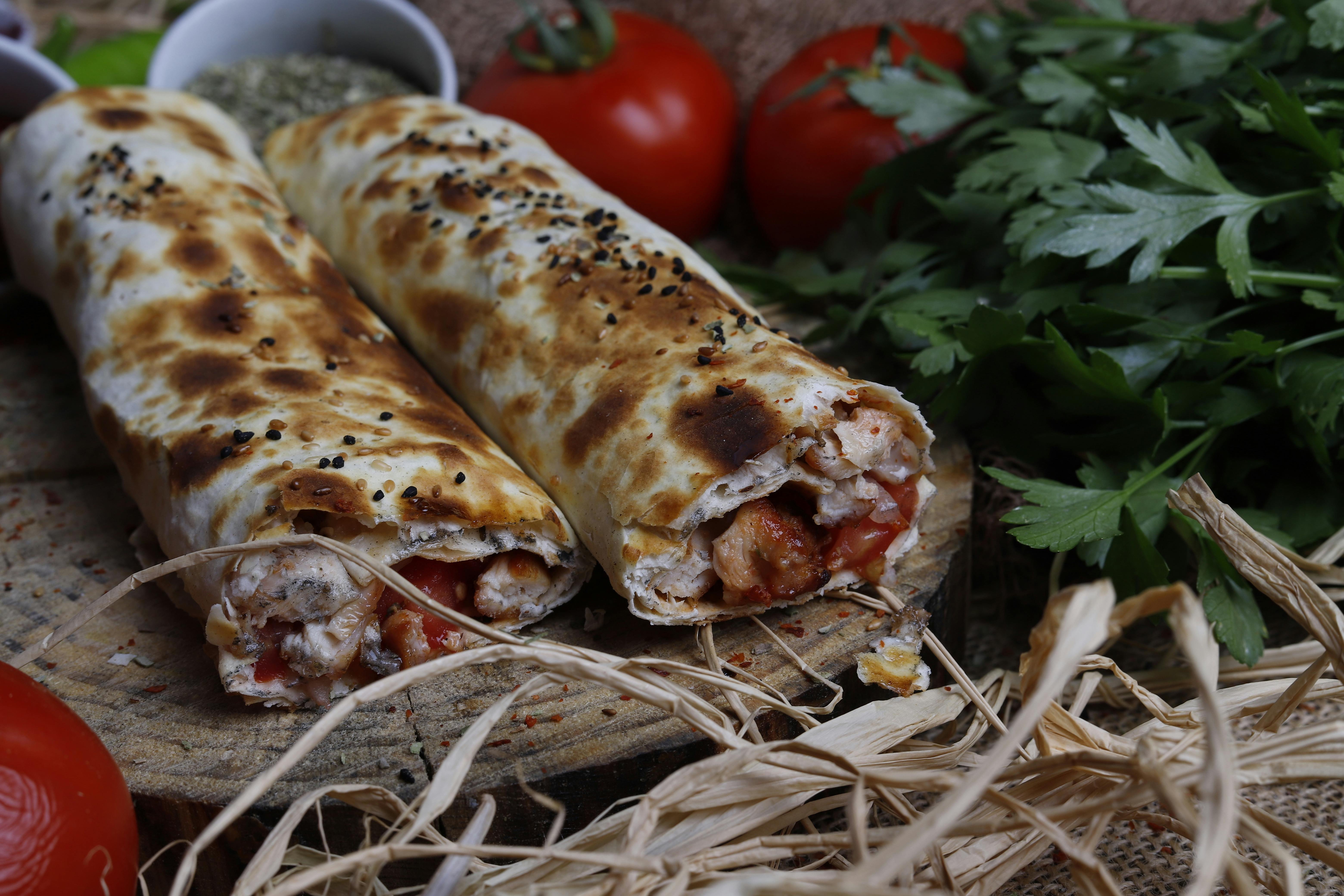 Close-up of Turkish Kebabs Lying among Raw Ingredients · Free Stock Photo