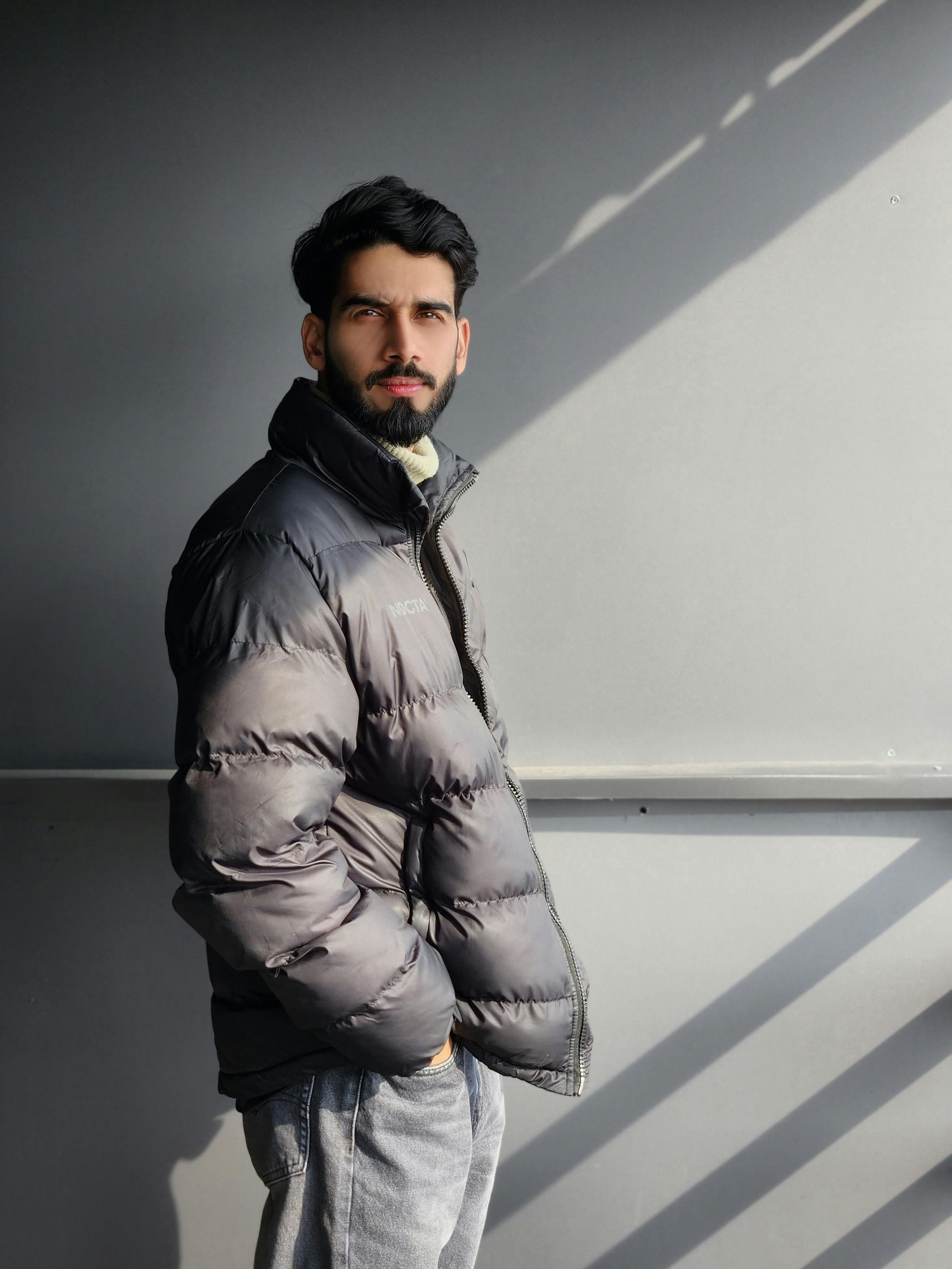 Grayscale Photo of Man Wearing Full-zipped Jacket While Putting His ...