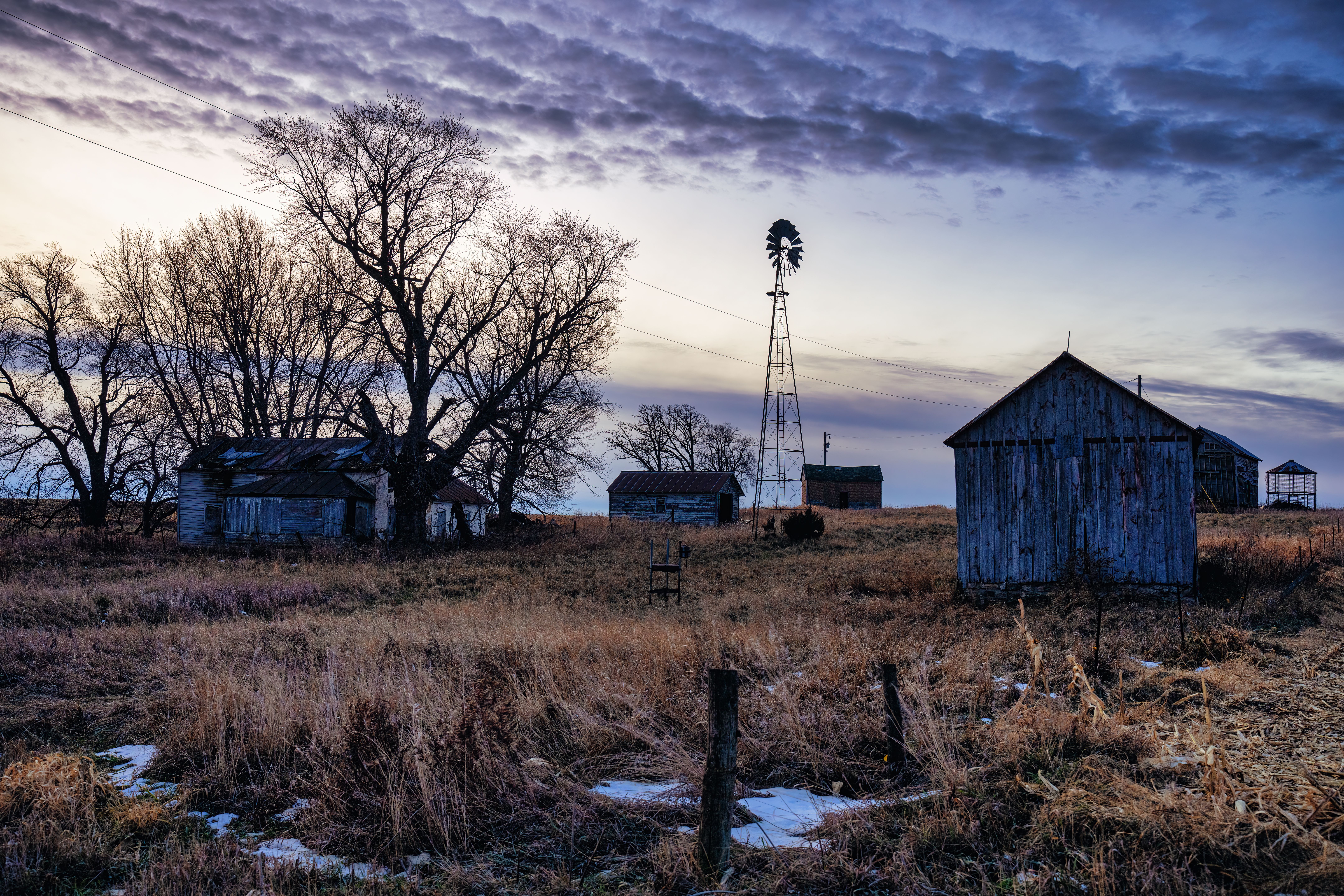 Windmill Near Wooden Barns · Free Stock Photo