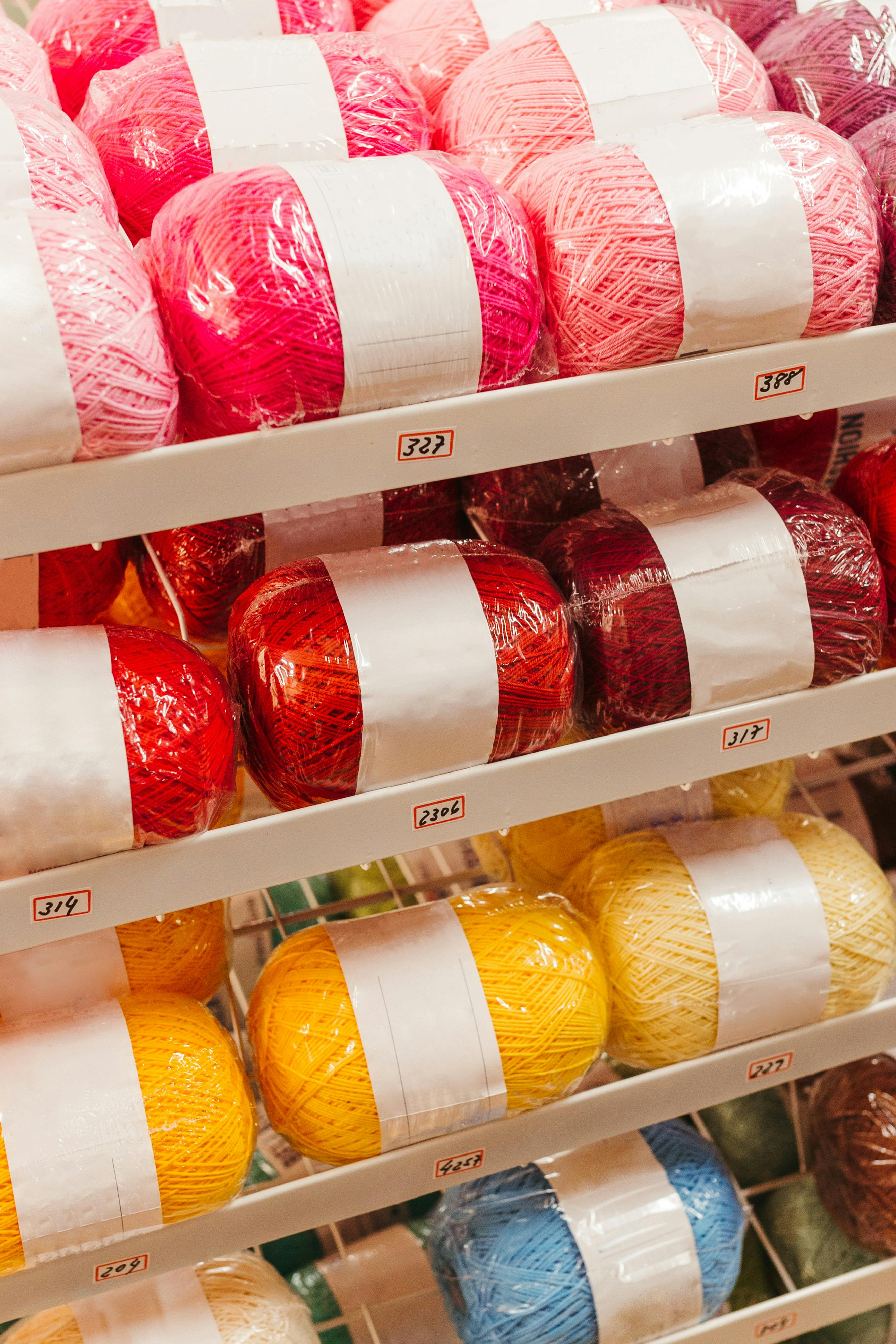 Photo of Colored Rolls of Yarn in a Shop · Free Stock Photo