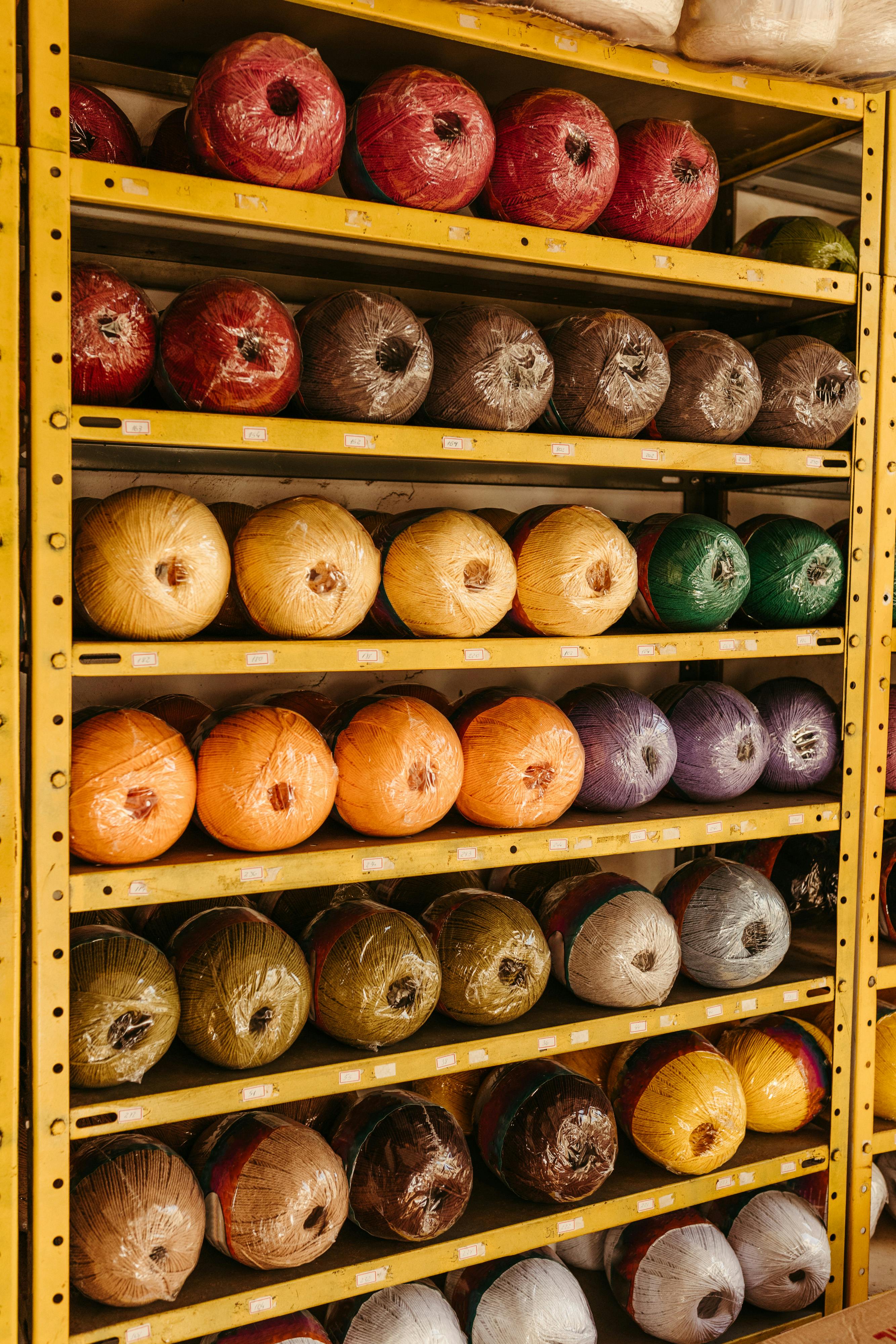 Wool Rolls on Shelves · Free Stock Photo