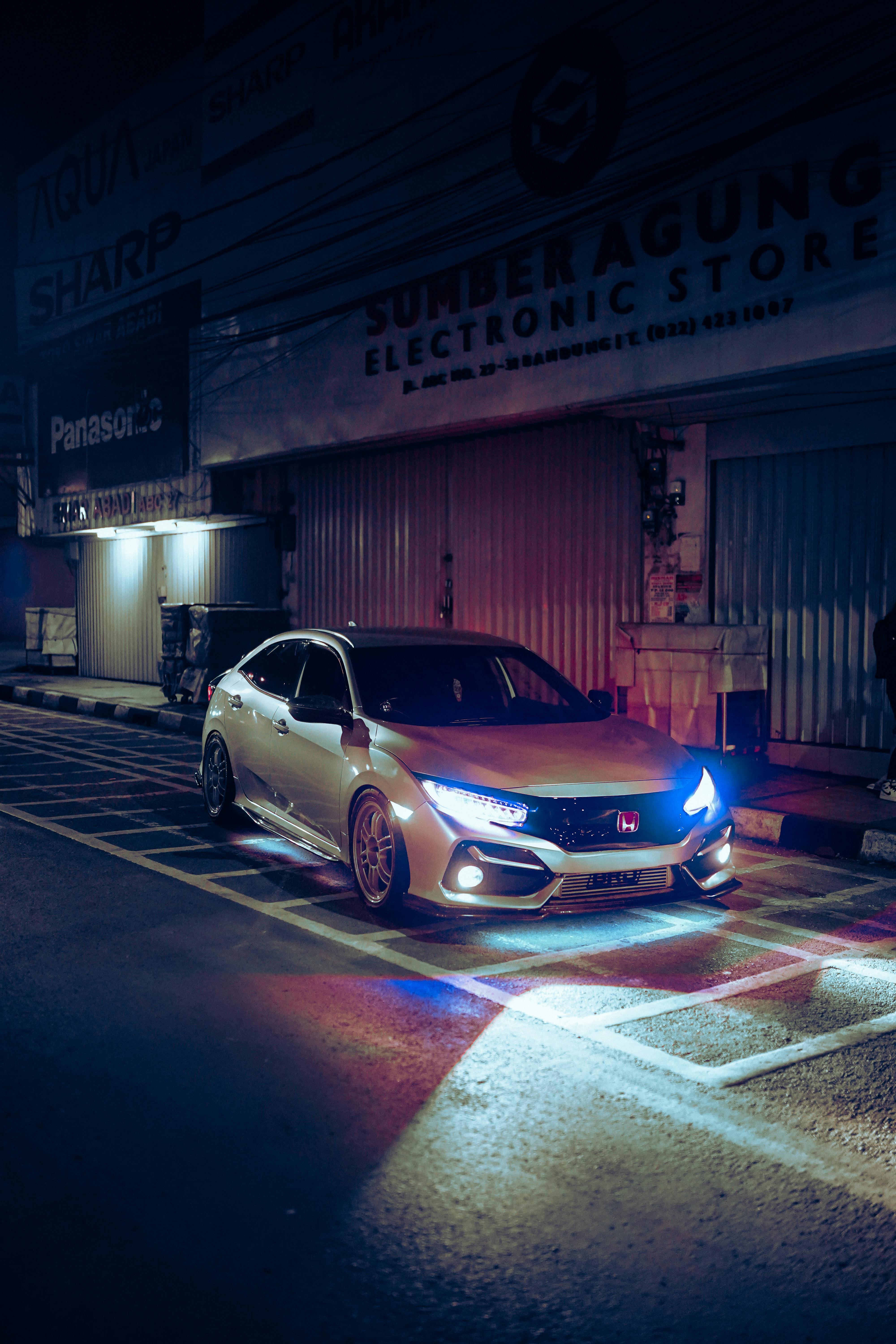 Car near Building at Night · Free Stock Photo