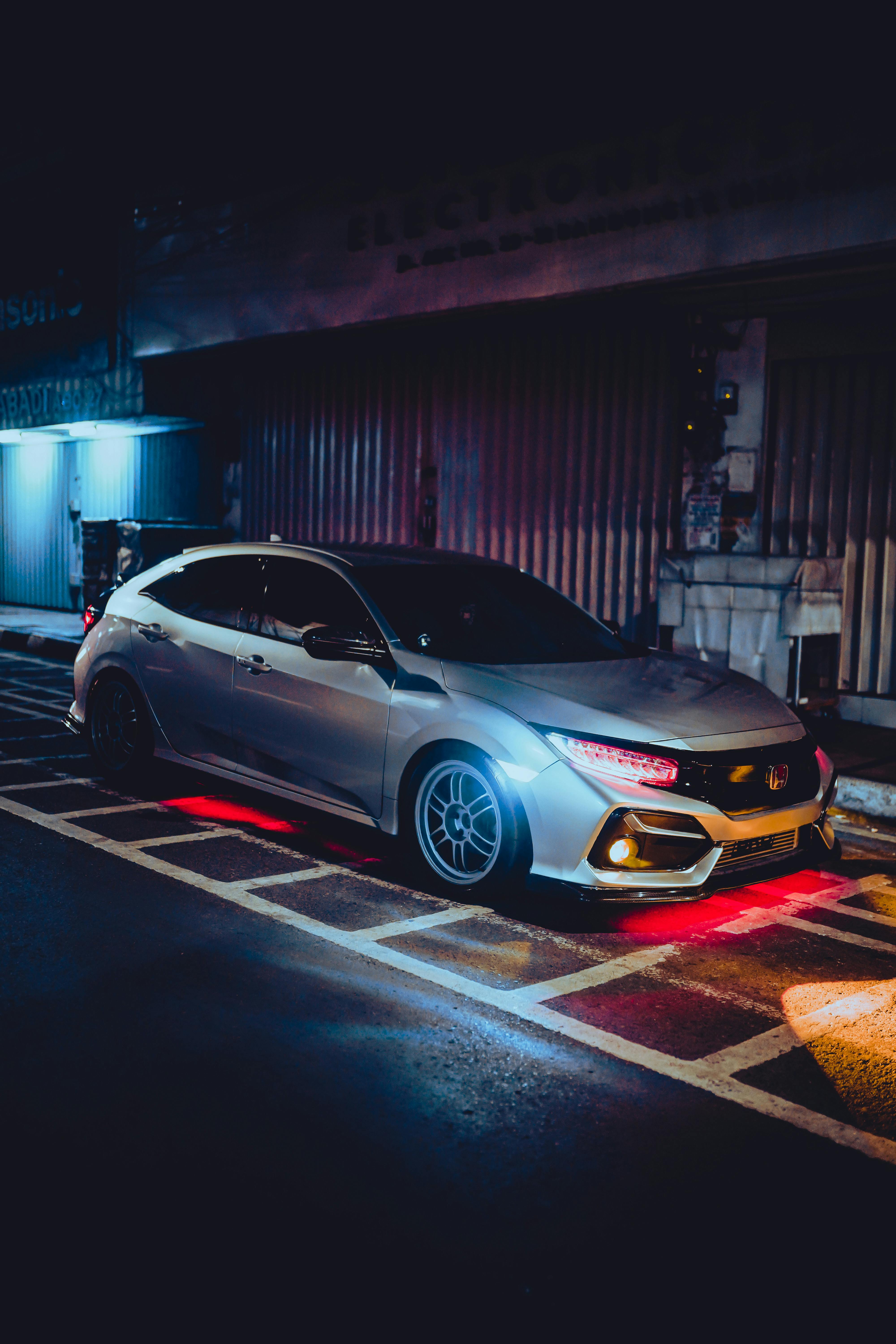 Sports Car Parked in front of a Store · Free Stock Photo