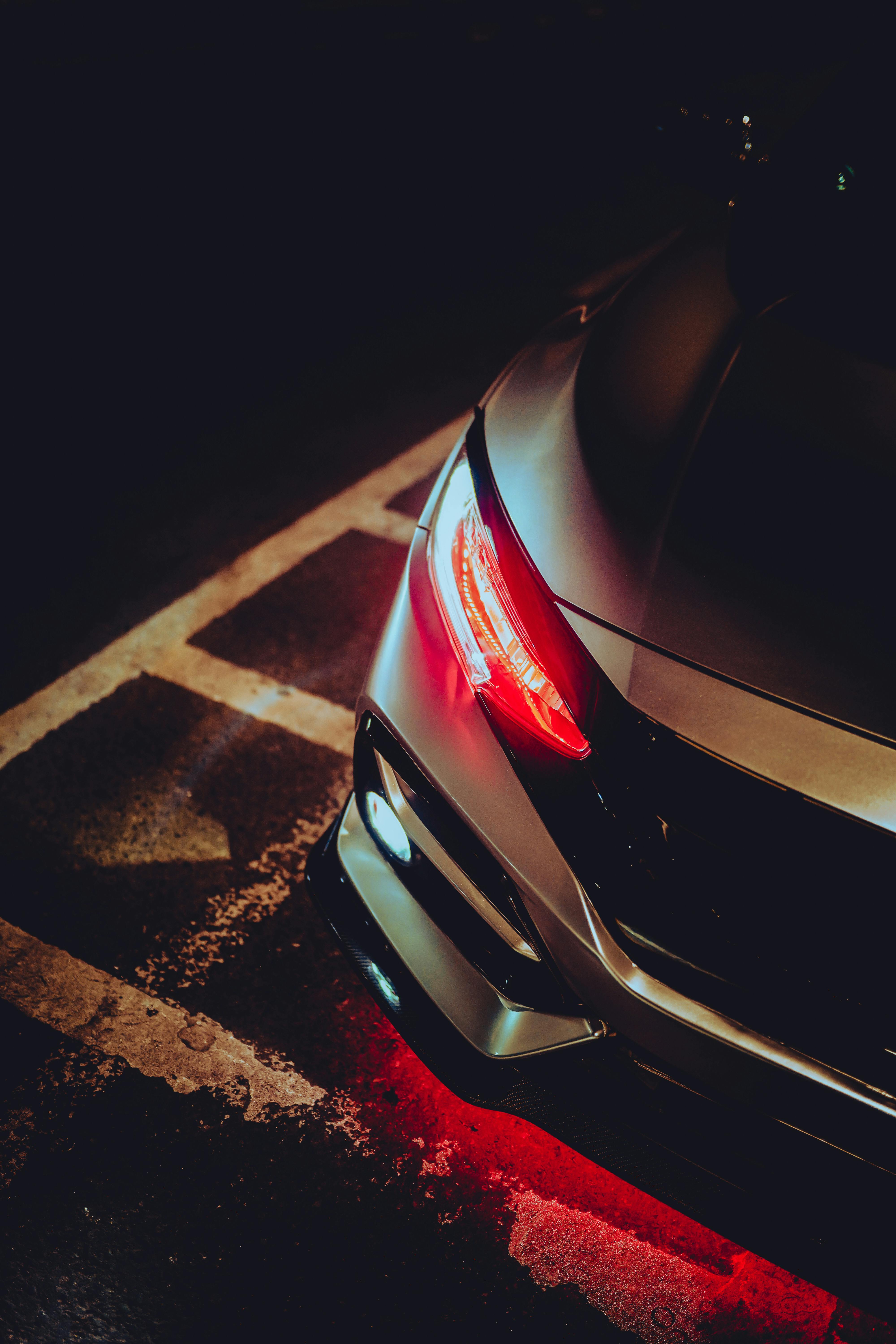 Red headlight on black car · Free Stock Photo