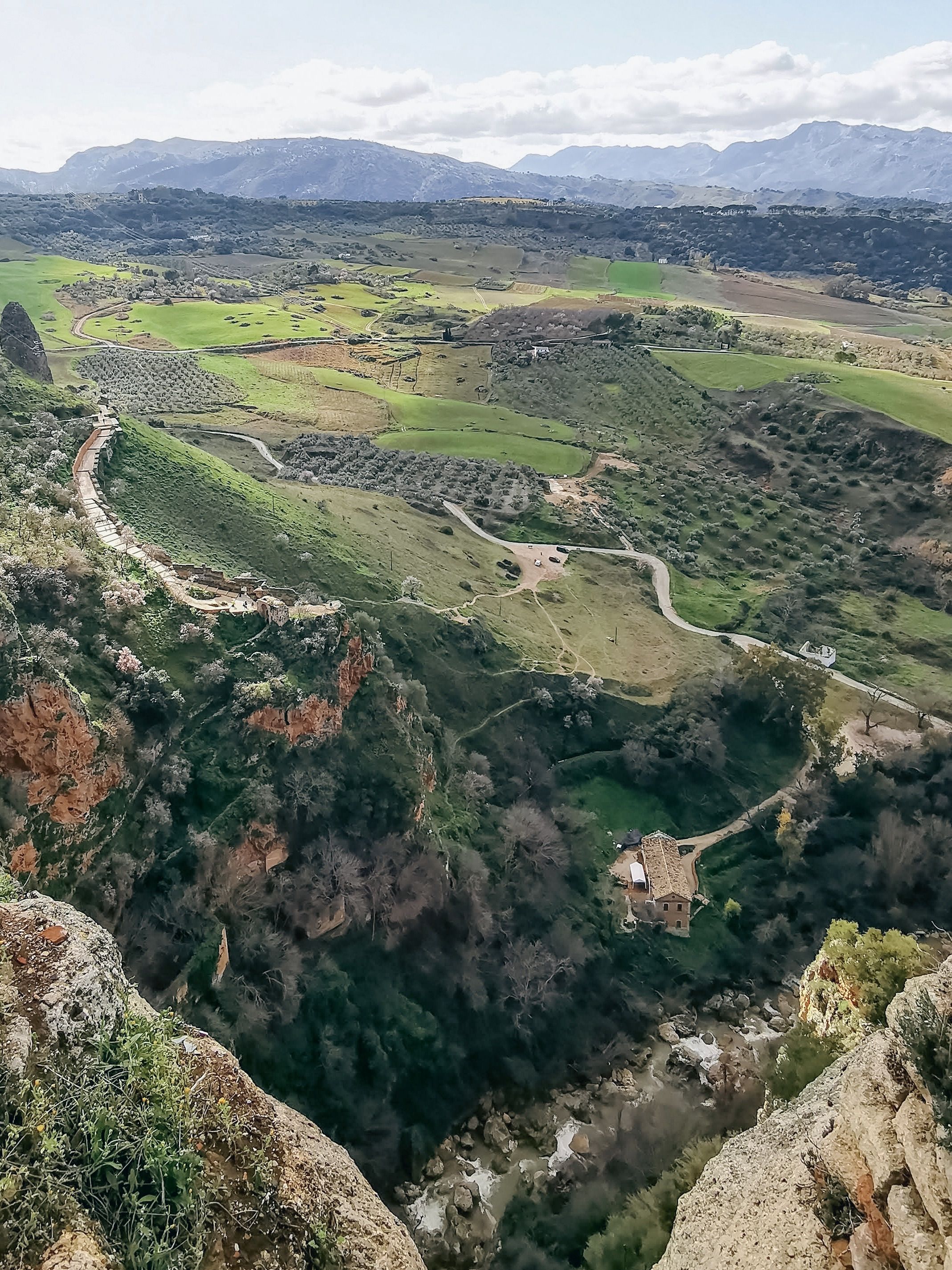 Castle in Green Valley near Rock Mountains · Free Stock Photo