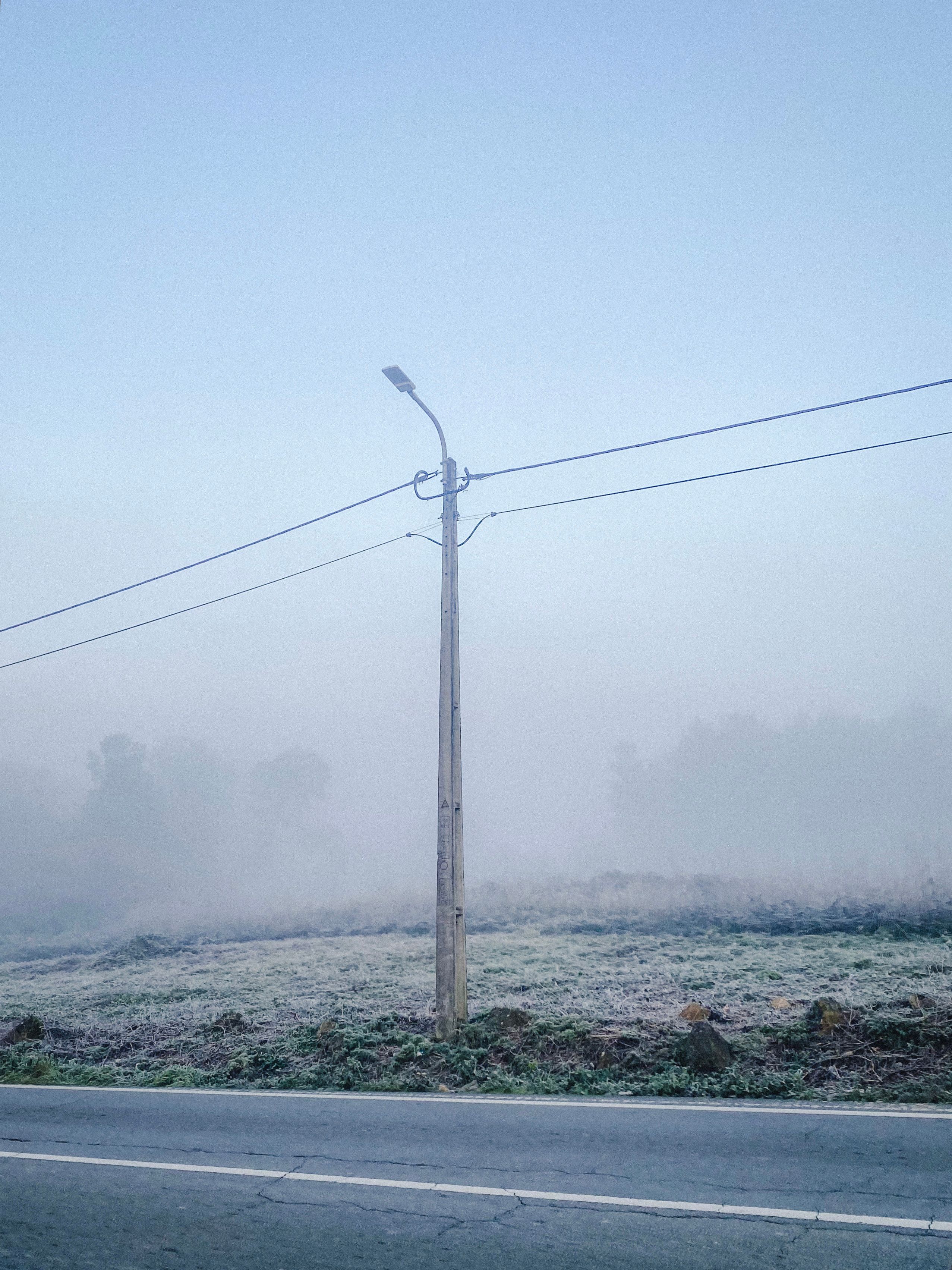Electricity Lines in Fog Winter Landscape · Free Stock Photo