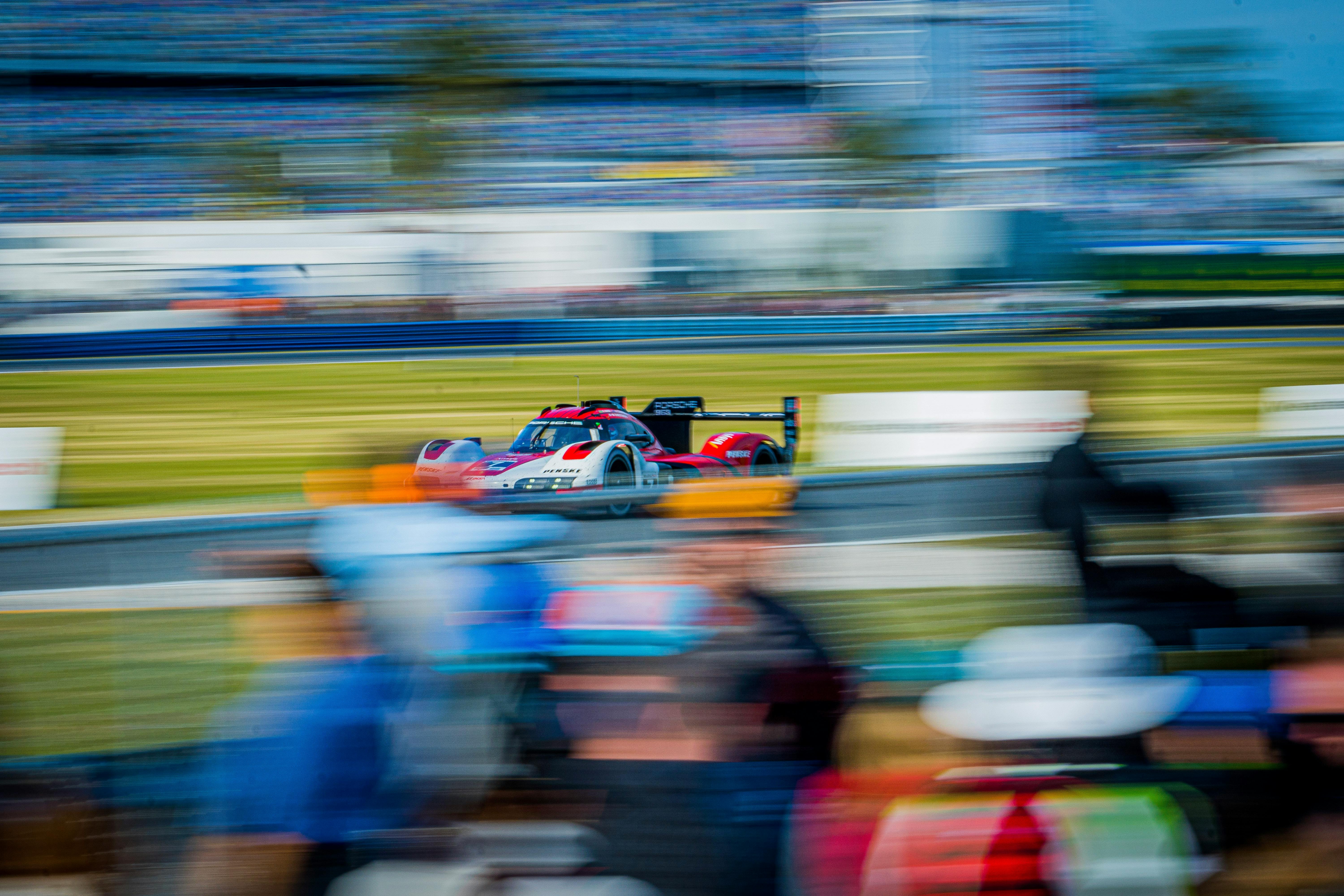 Red Racing Car on Race Track during Daytime · Free Stock Photo