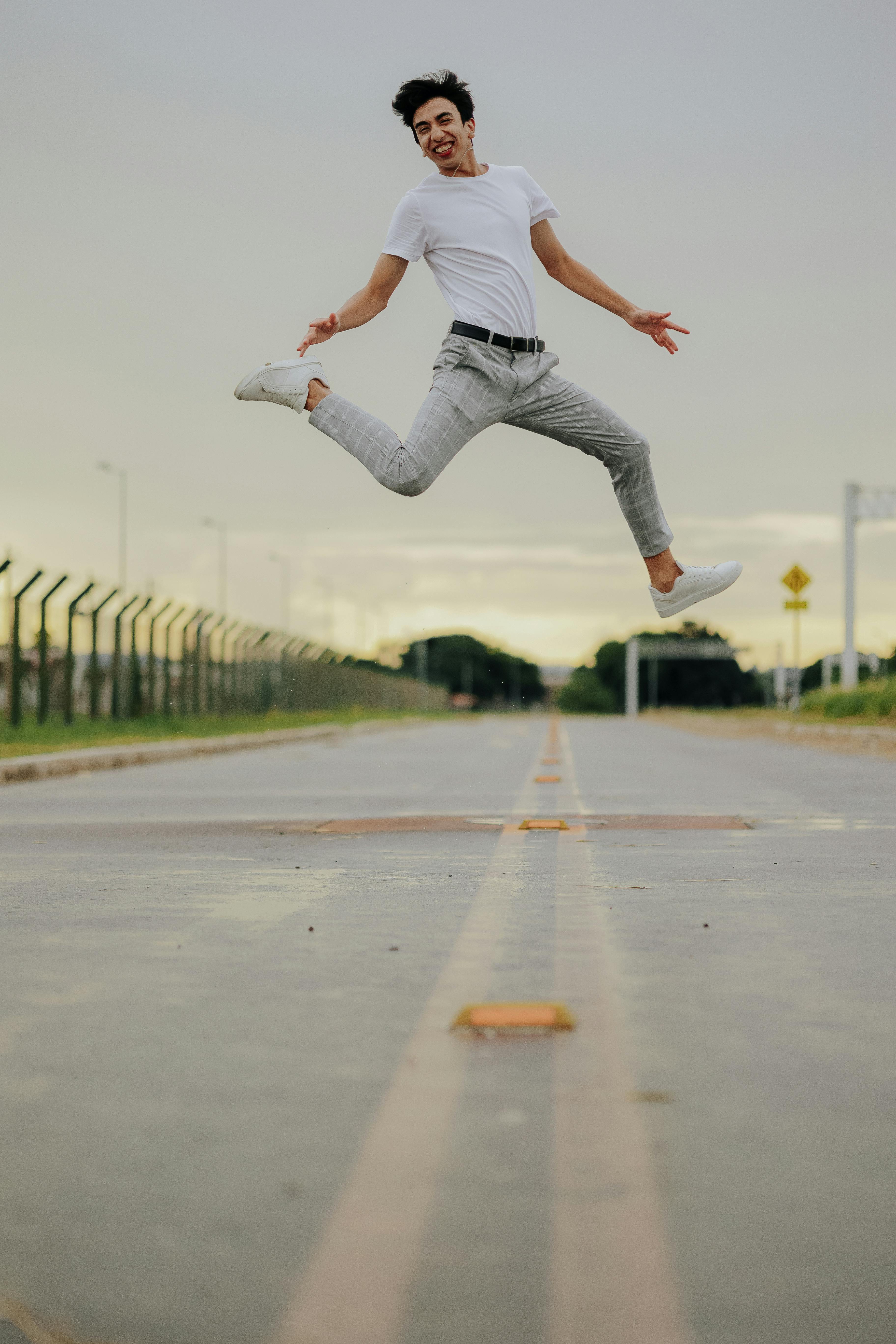 Man Jumping over Road · Free Stock Photo