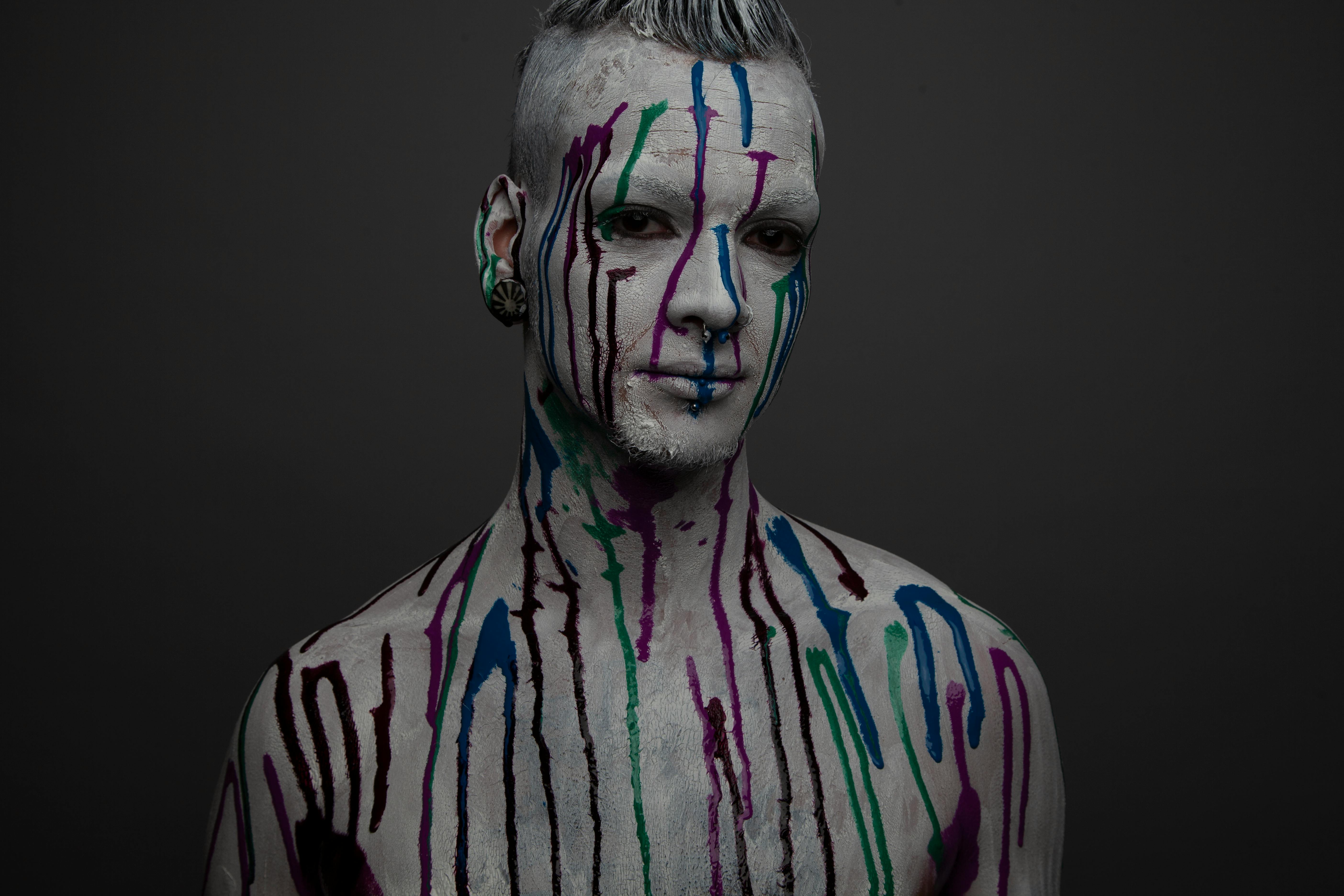 Man Looking at Gray Paint Sample · Free Stock Photo