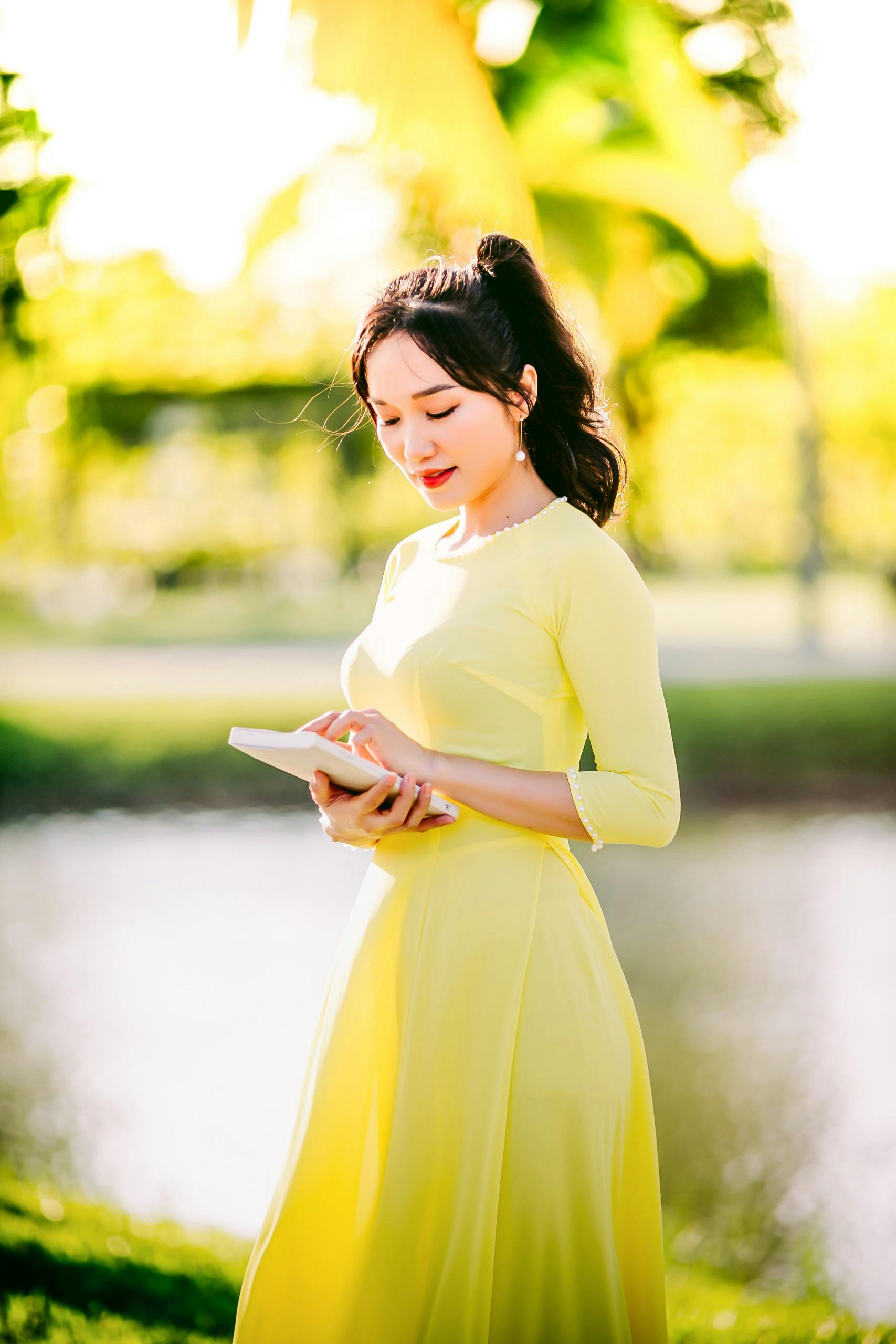 Standing Young Woman in Yellow Dress · Free Stock Photo