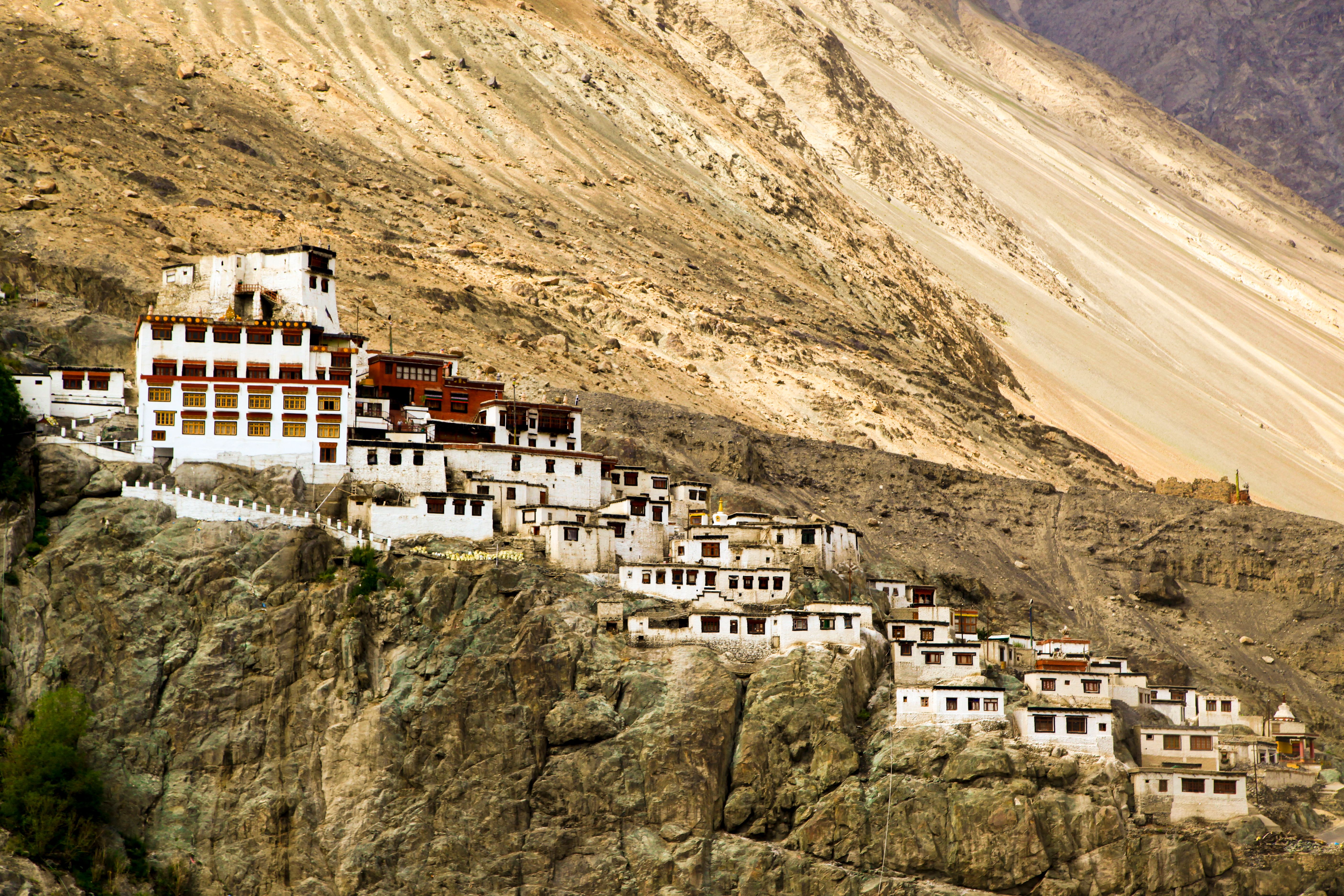 Buildings in Village on Rock Edge · Free Stock Photo