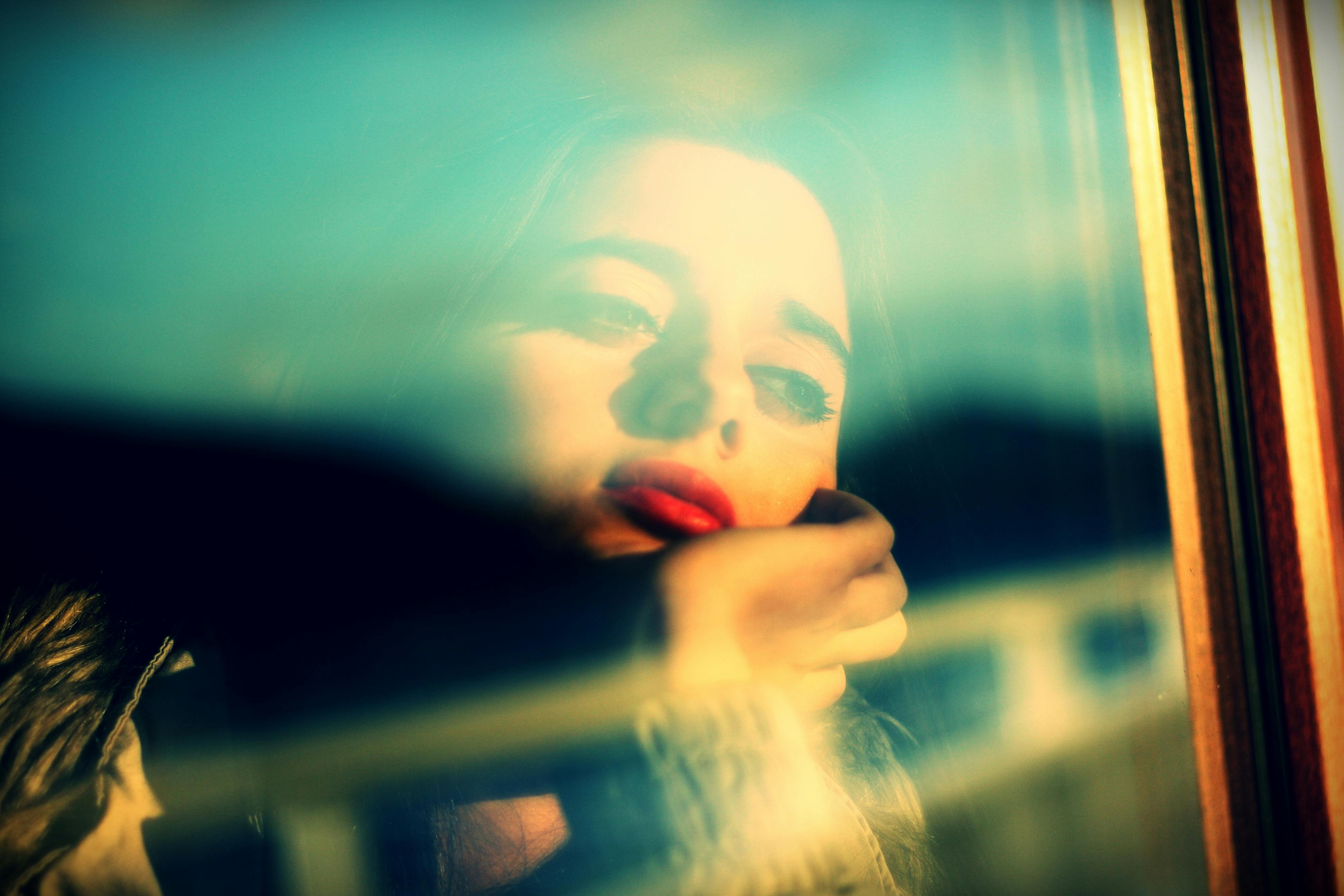 Woman Looking Out the Window Photographed from behind the Window · Free ...
