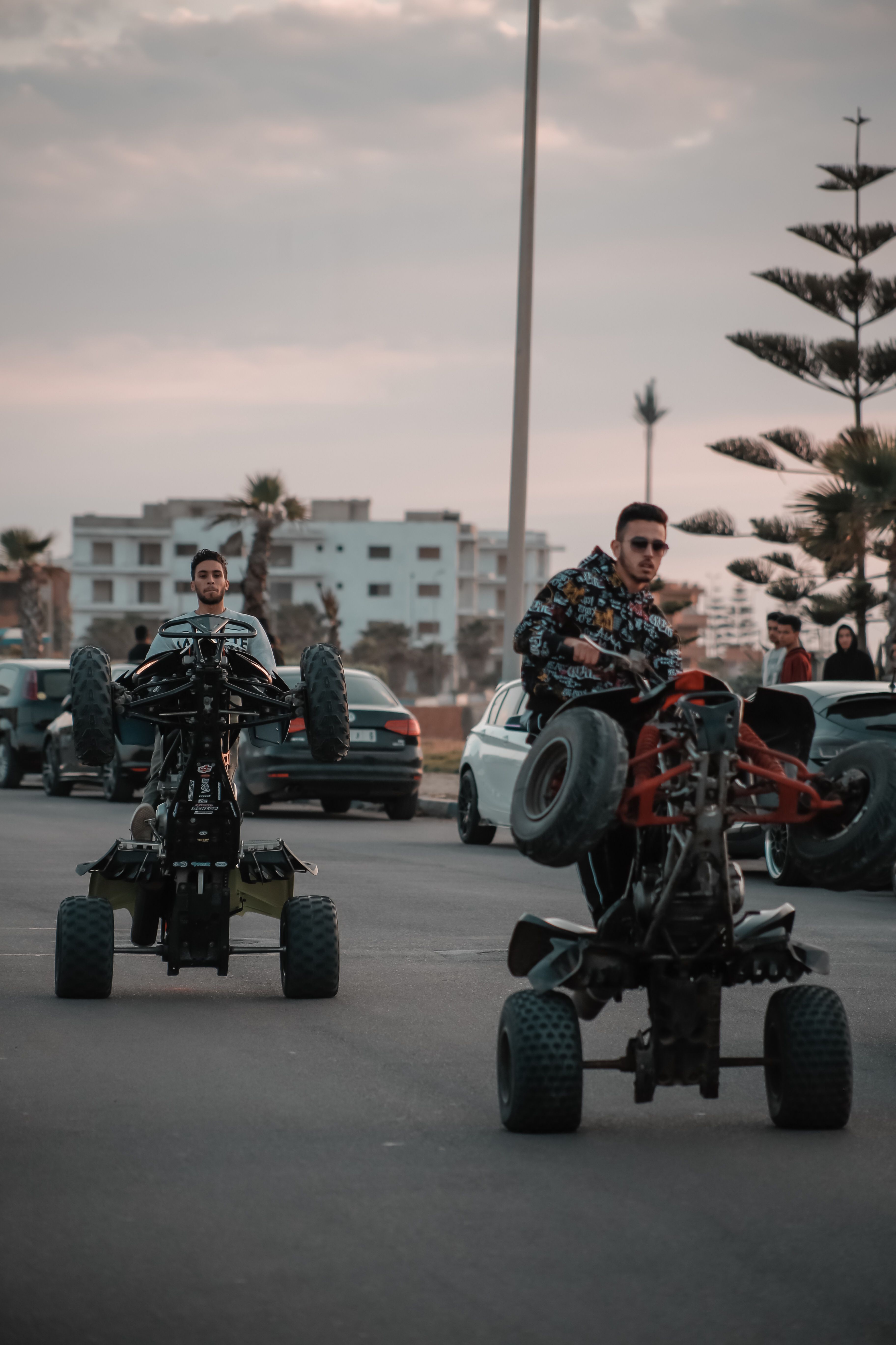 Men on Quads on a Street · Free Stock Photo
