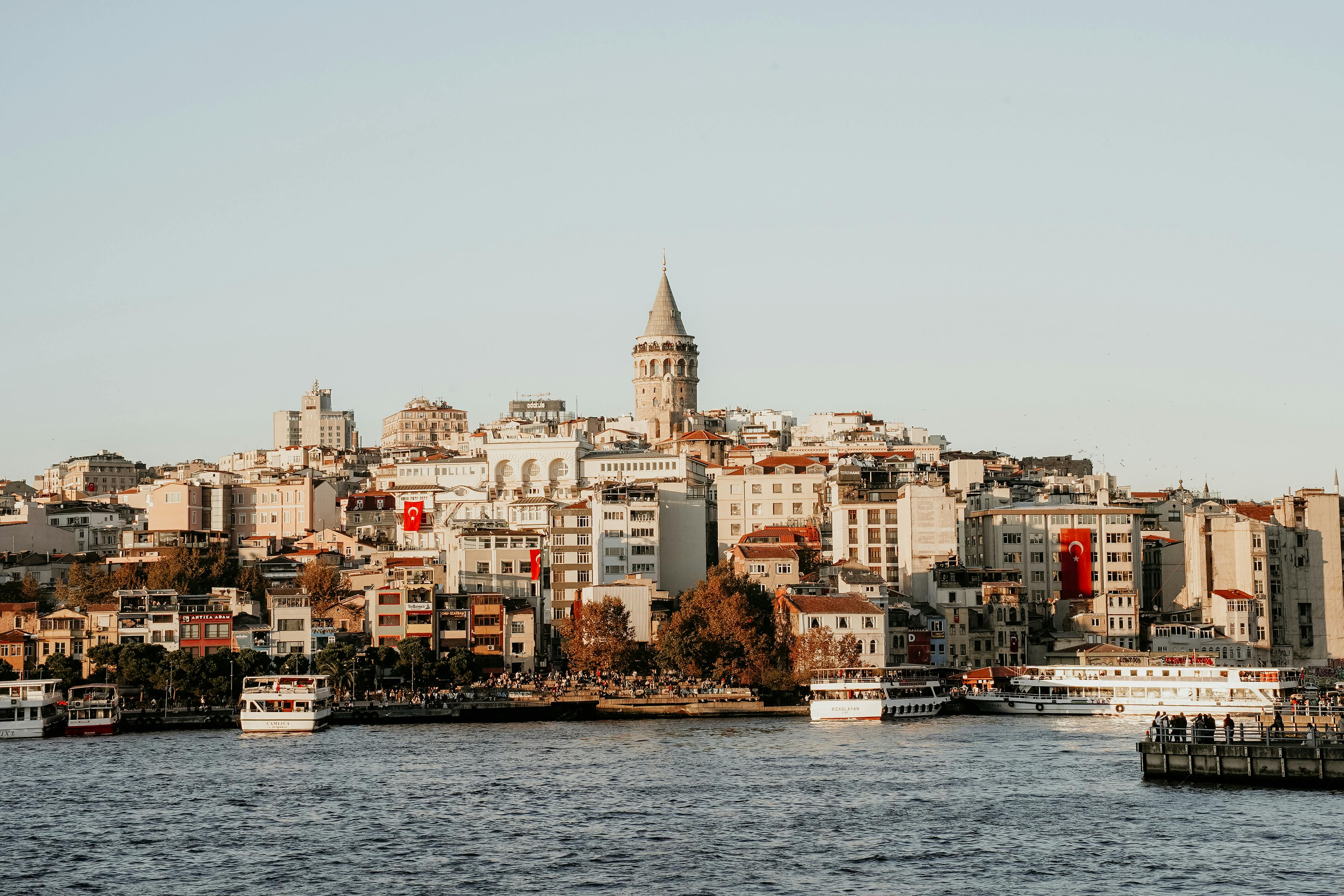 Flags of Turkiye in Cityscape with Galata Tower · Free Stock Photo