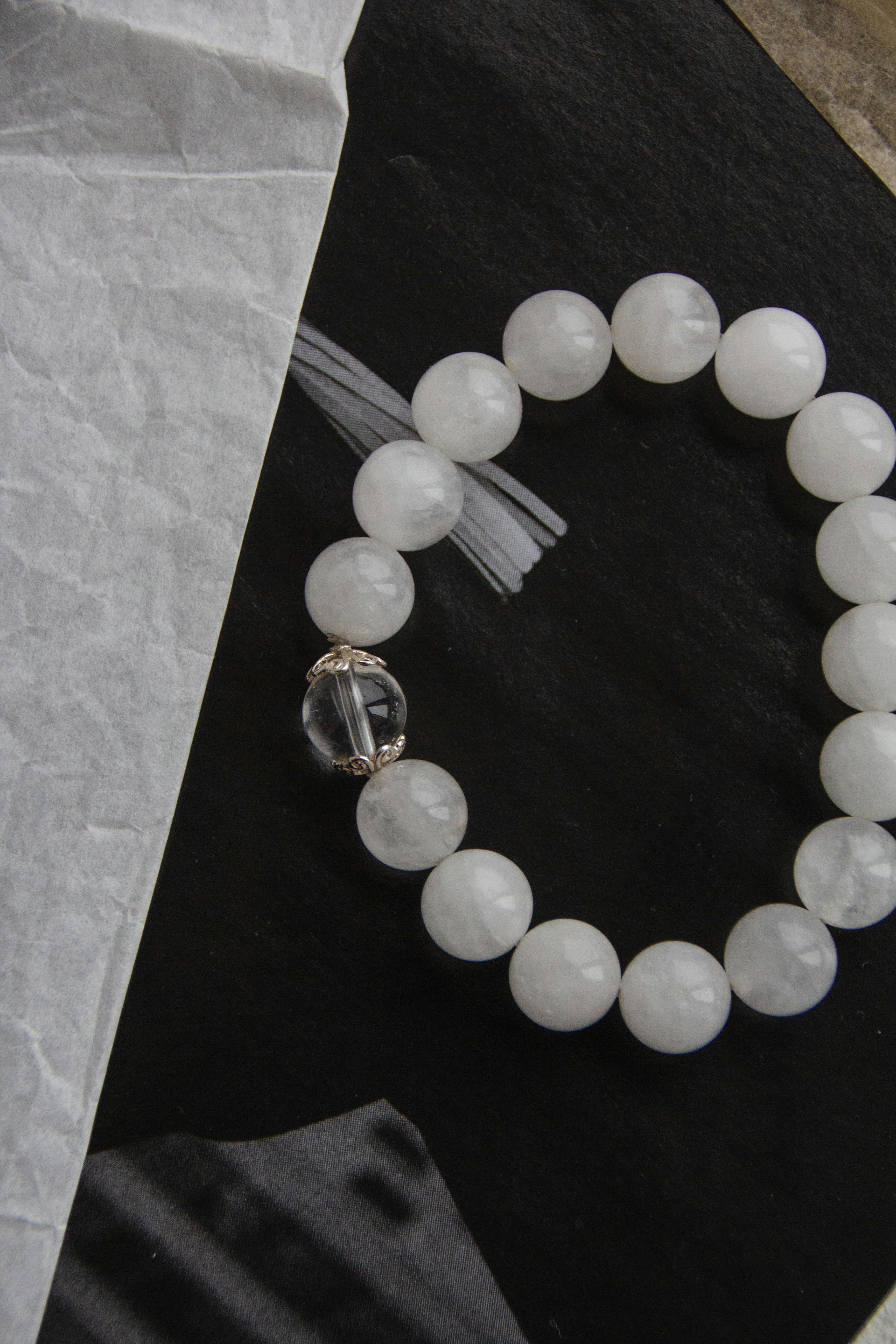 White Pearl Necklace on Table · Free Stock Photo