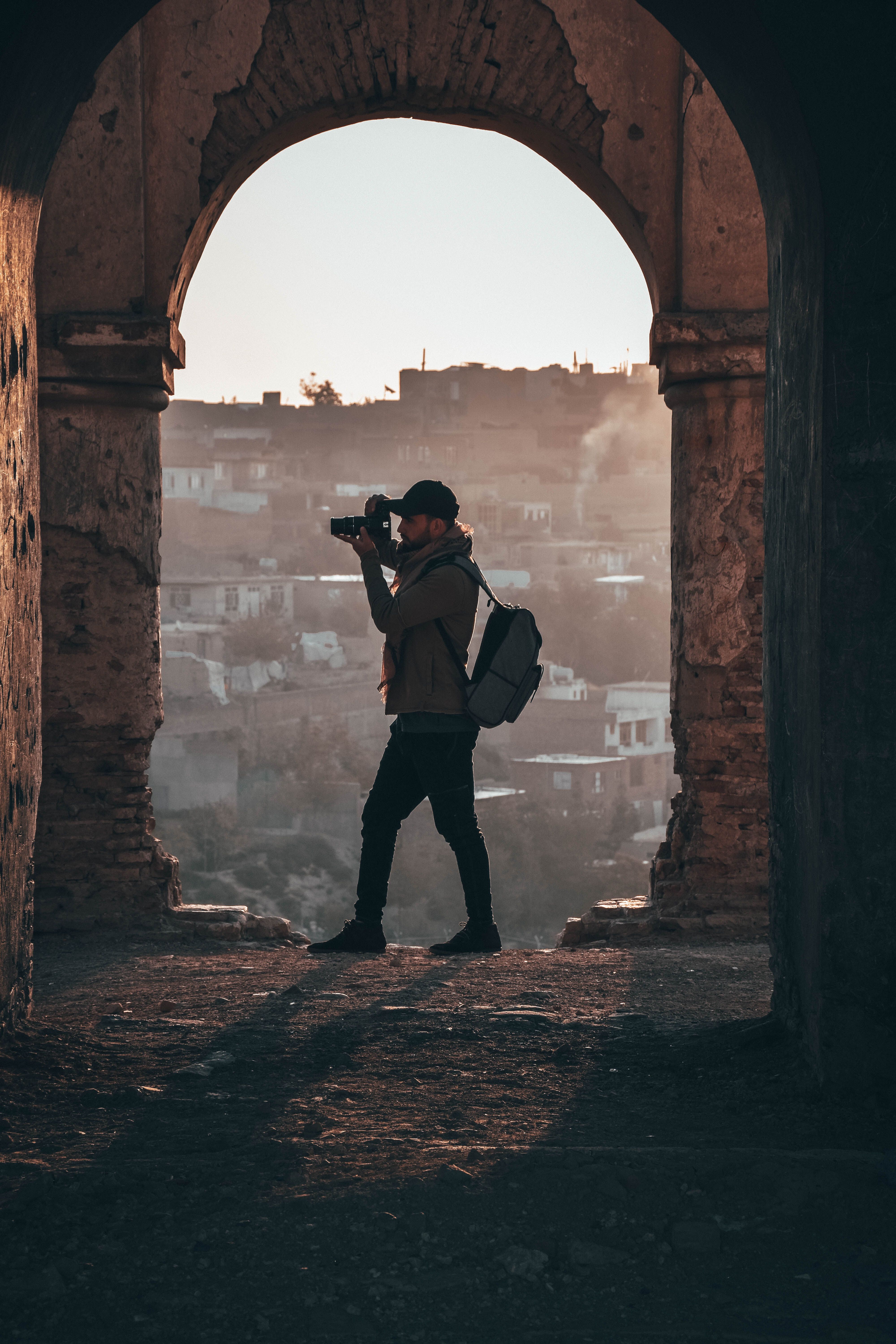 Photographer Capturing Inside Ruins · Free Stock Photo