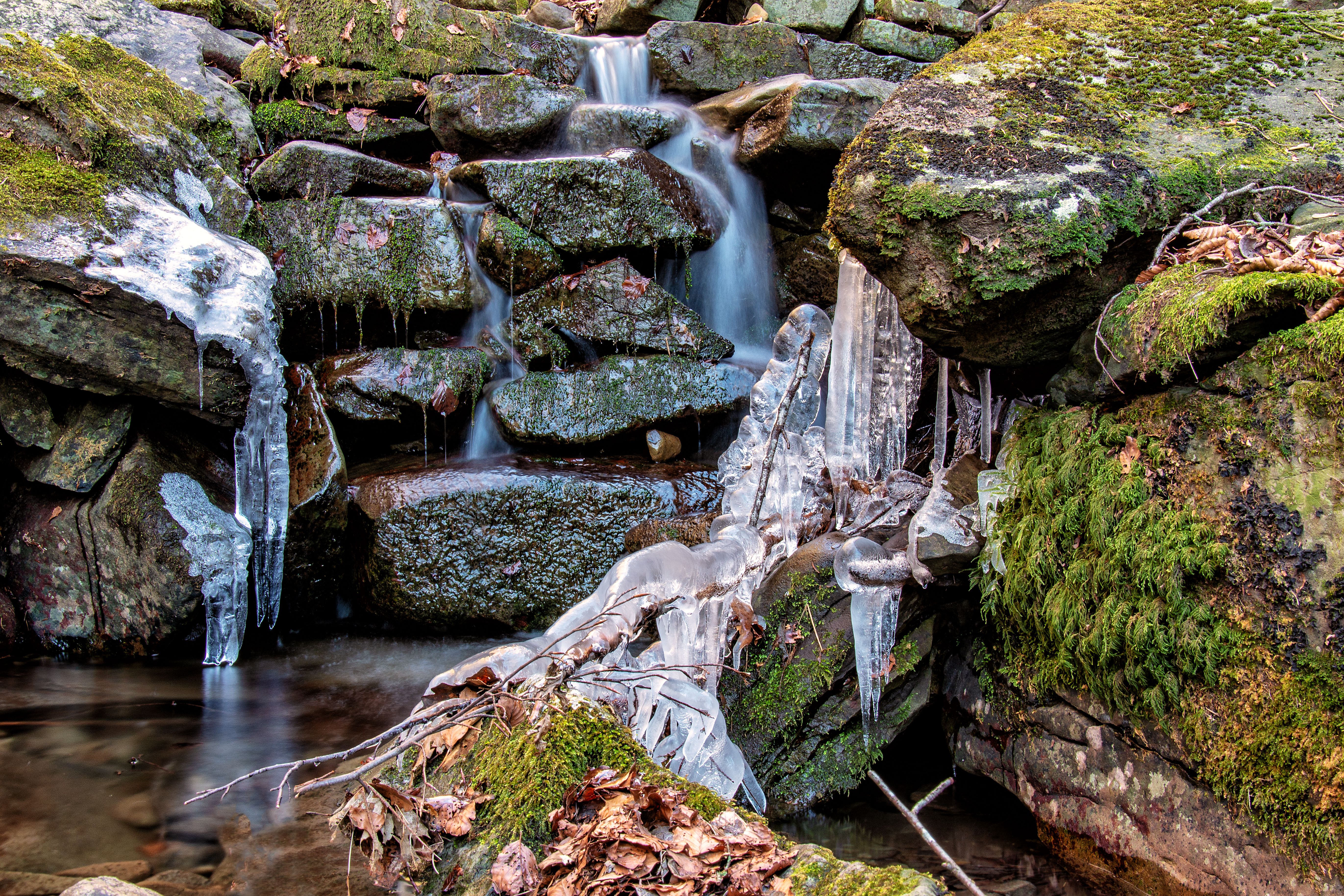 Icicles and Stream Cascading from Rocks · Free Stock Photo