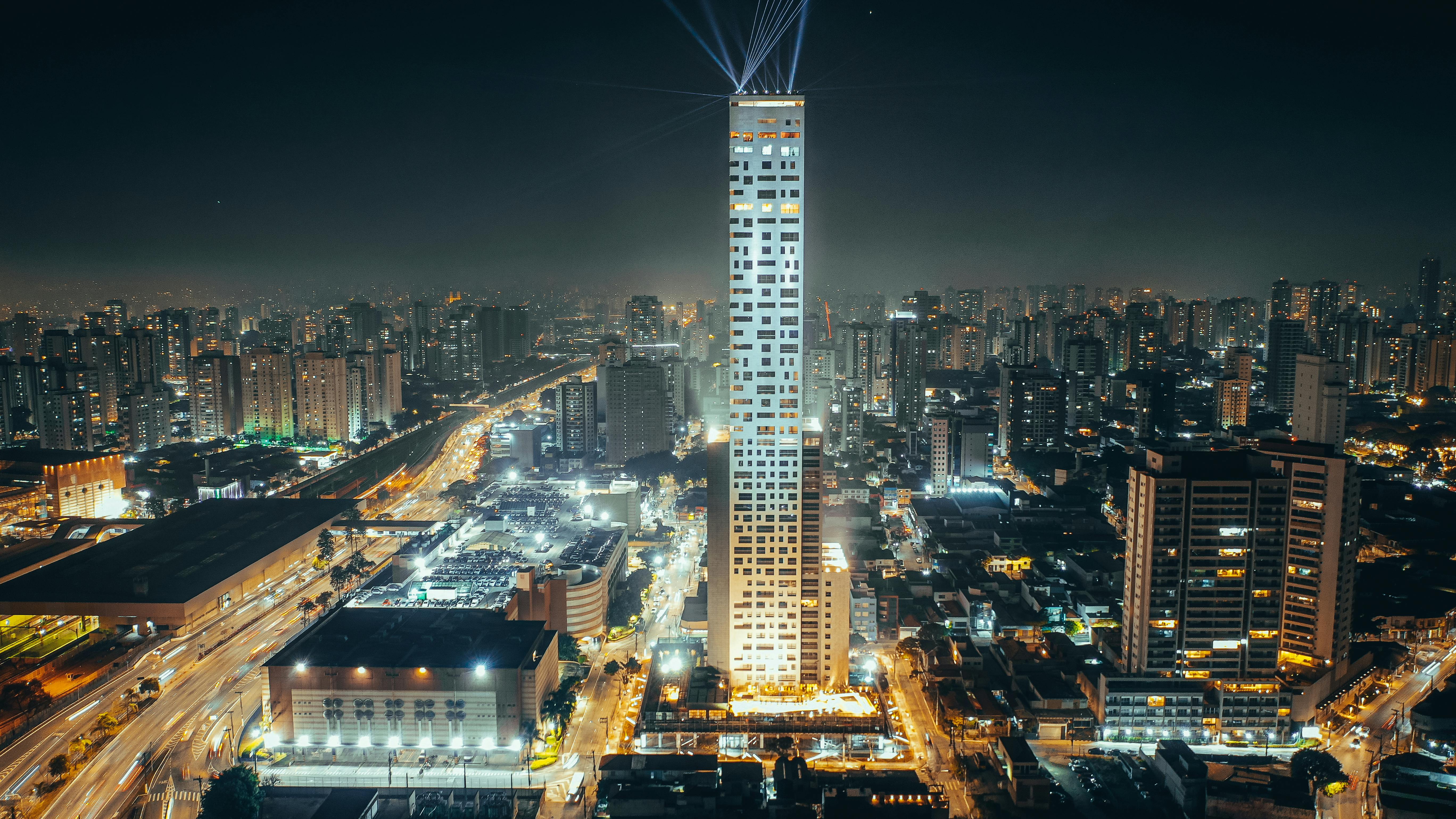 Photography of a Person Watching over City Lights during Night Time ...
