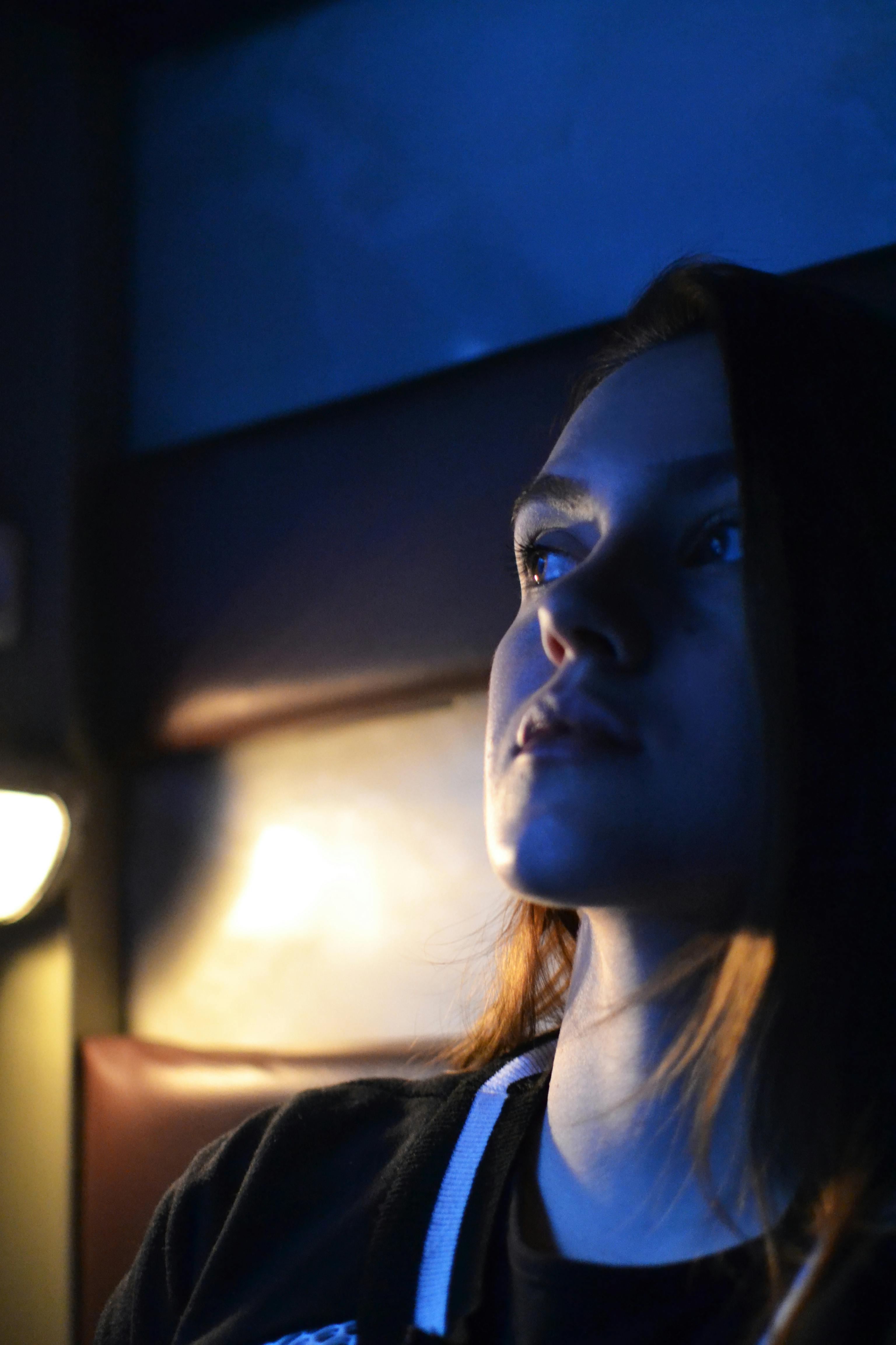 Close-up of Girl in Dark Room with Light · Free Stock Photo