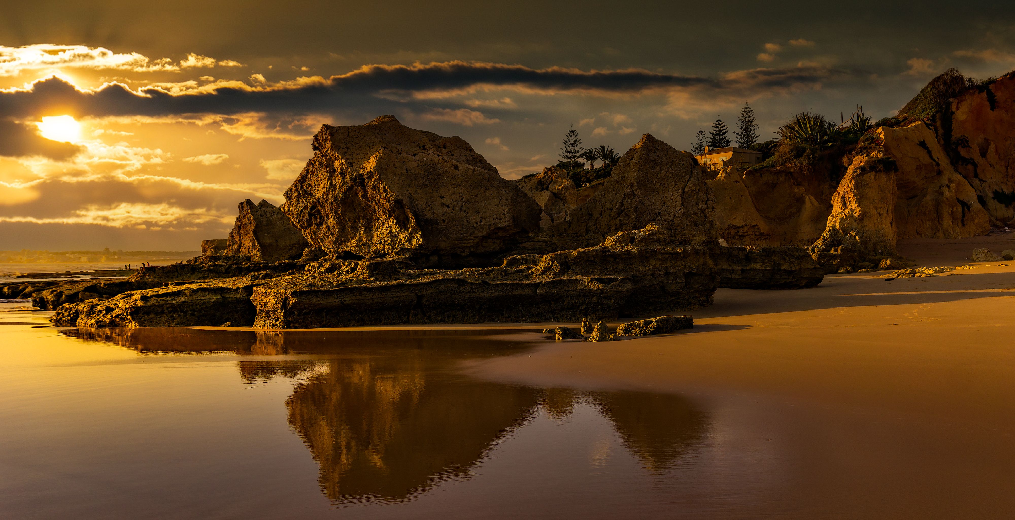 Rock Formation on a Beach at Sunset · Free Stock Photo