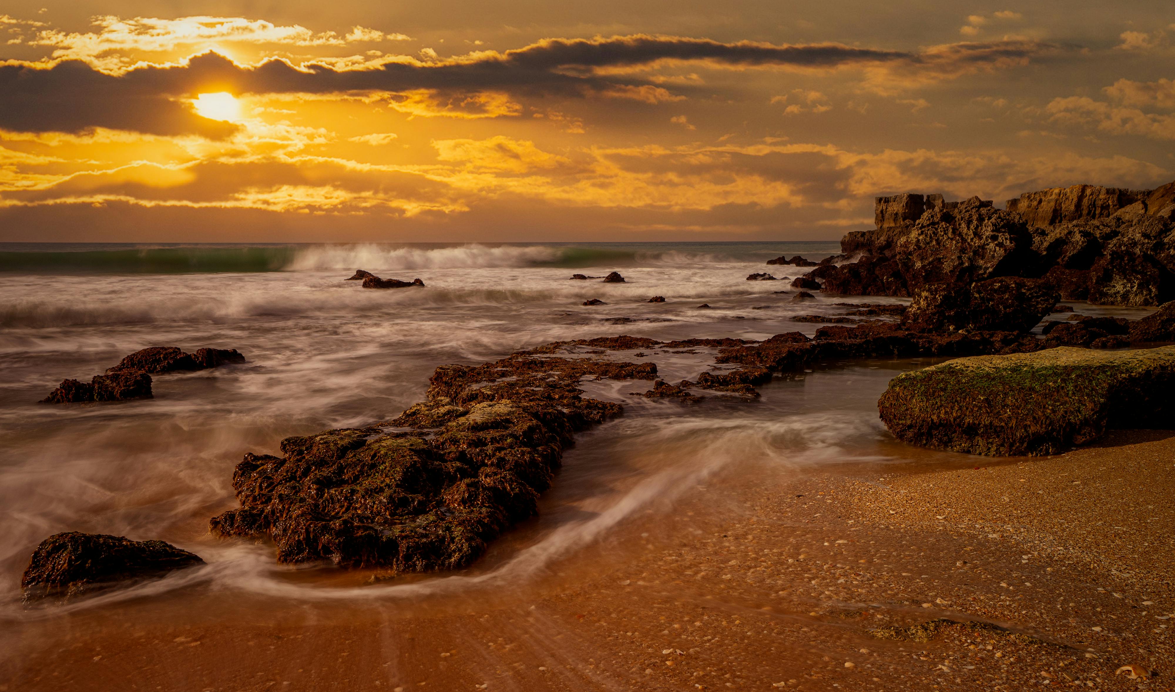 Waves Splashing at Stones on Beach during Sunset · Free Stock Photo