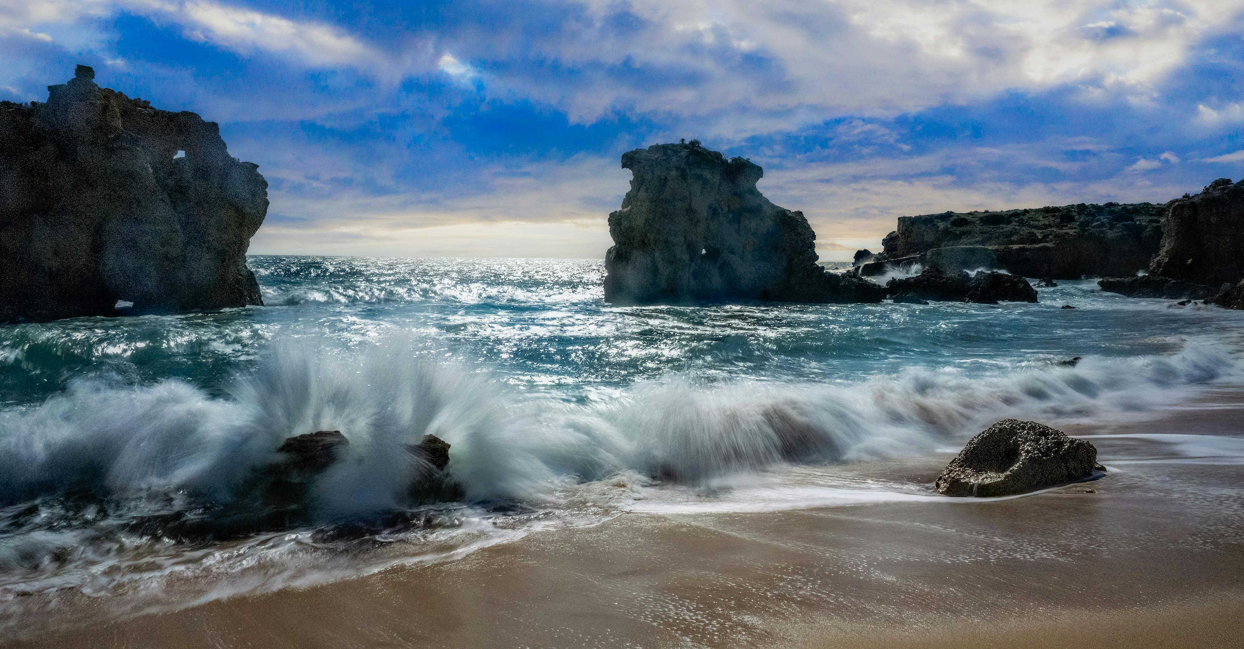 Sea Waves Splashing Through Rocks · Free Stock Photo
