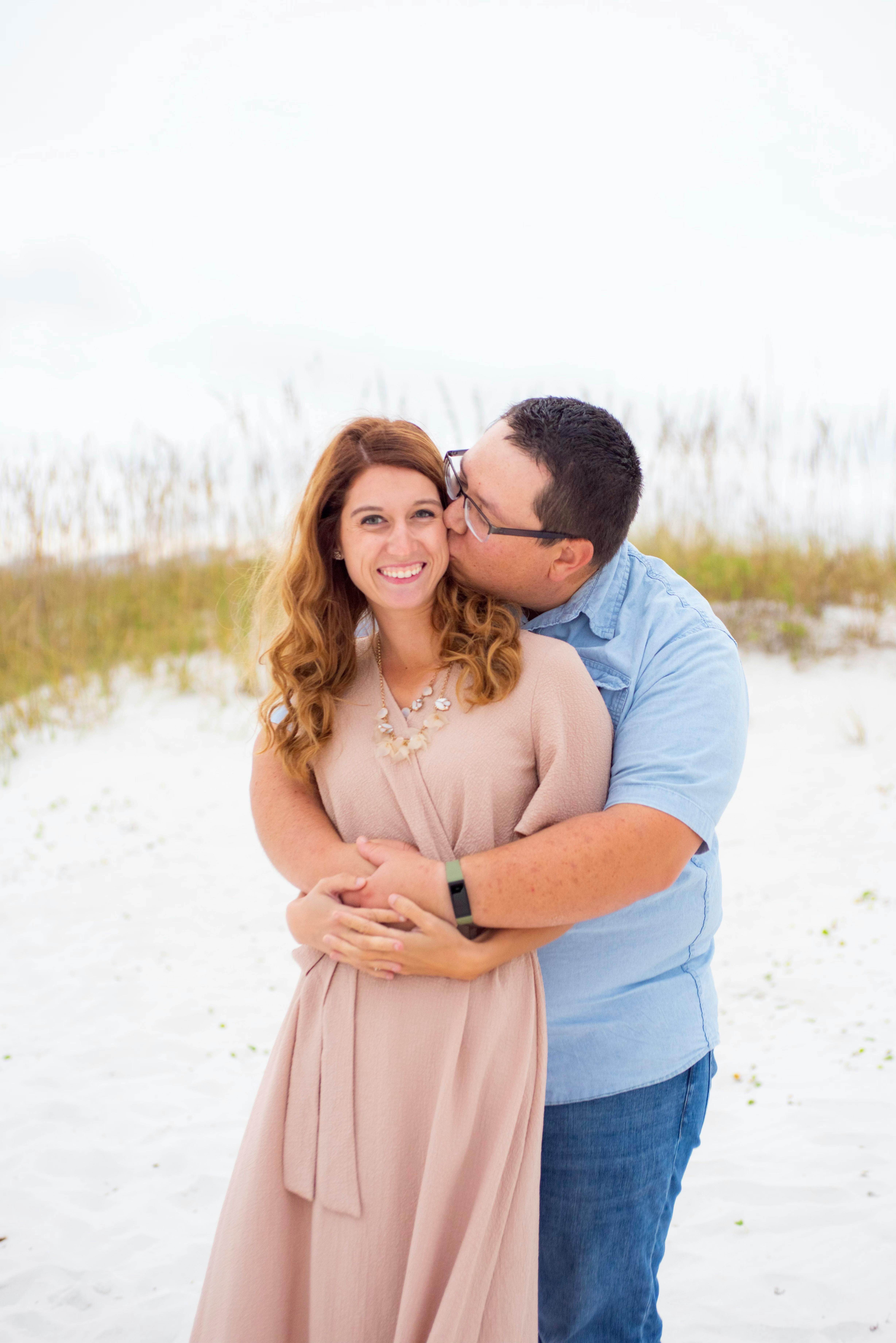 Man Kissing Military Woman on Cheek · Free Stock Photo