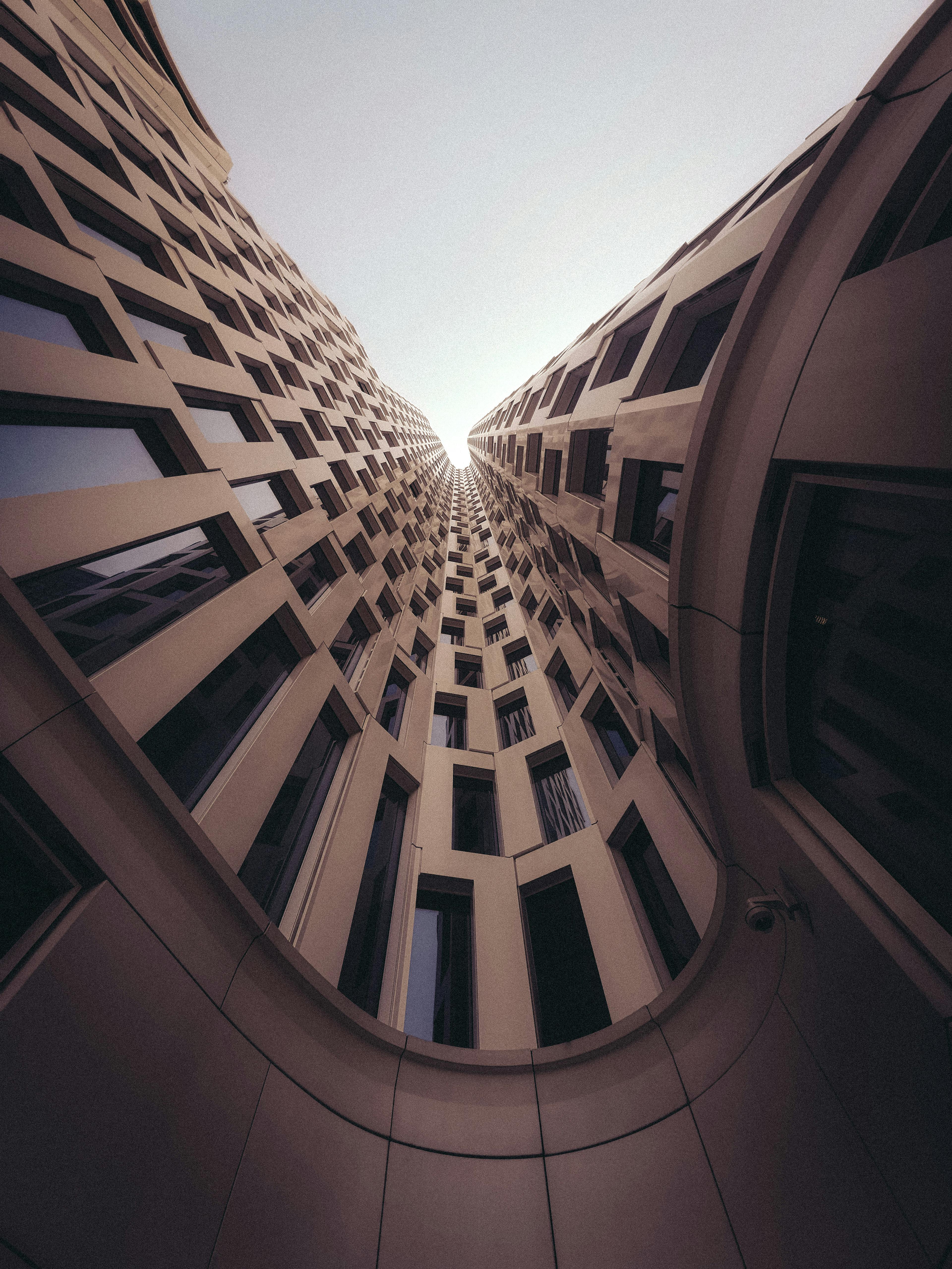 Low Angle Shot of Bent Building · Free Stock Photo