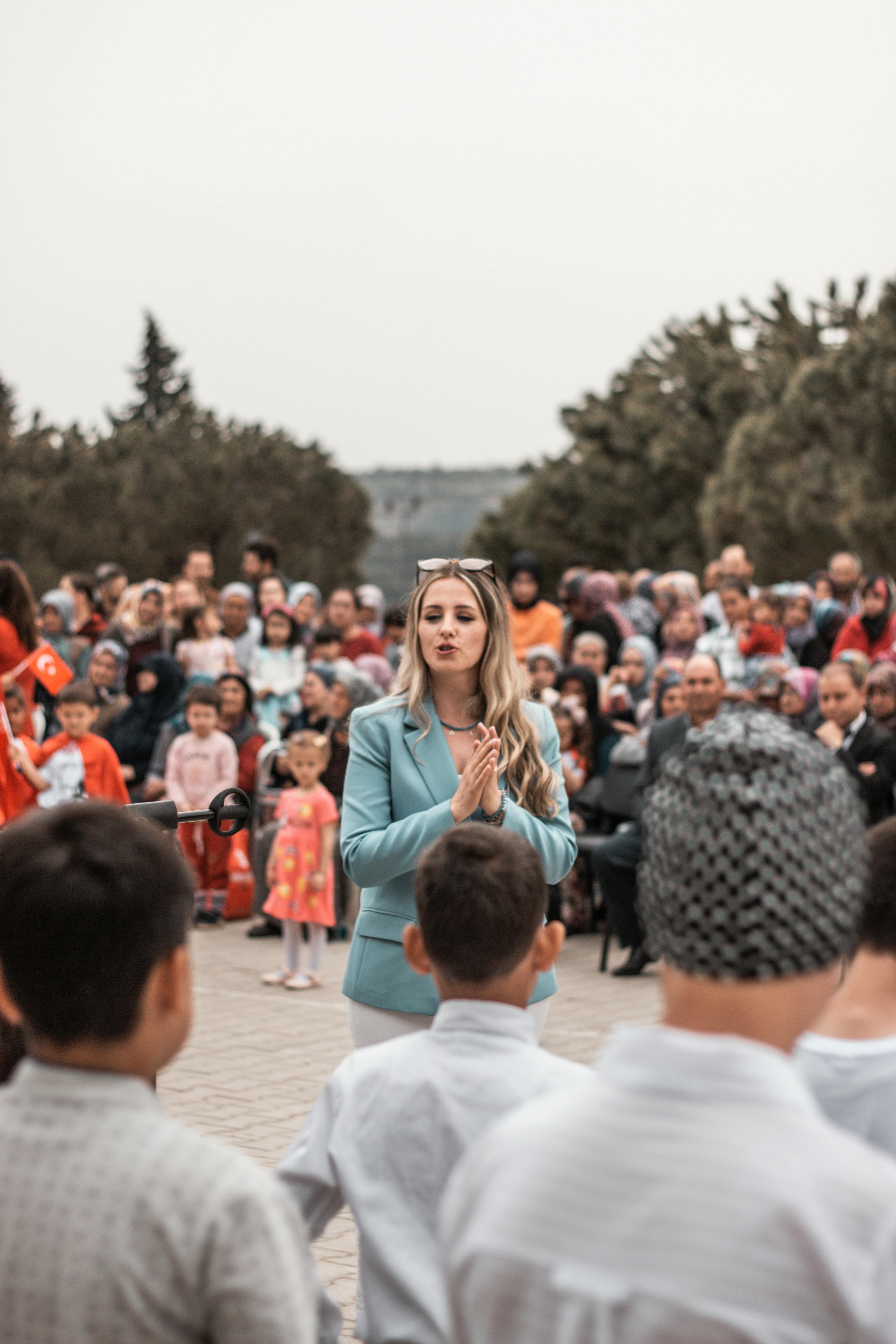 Young Woman Speaking to a Crowd · Free Stock Photo