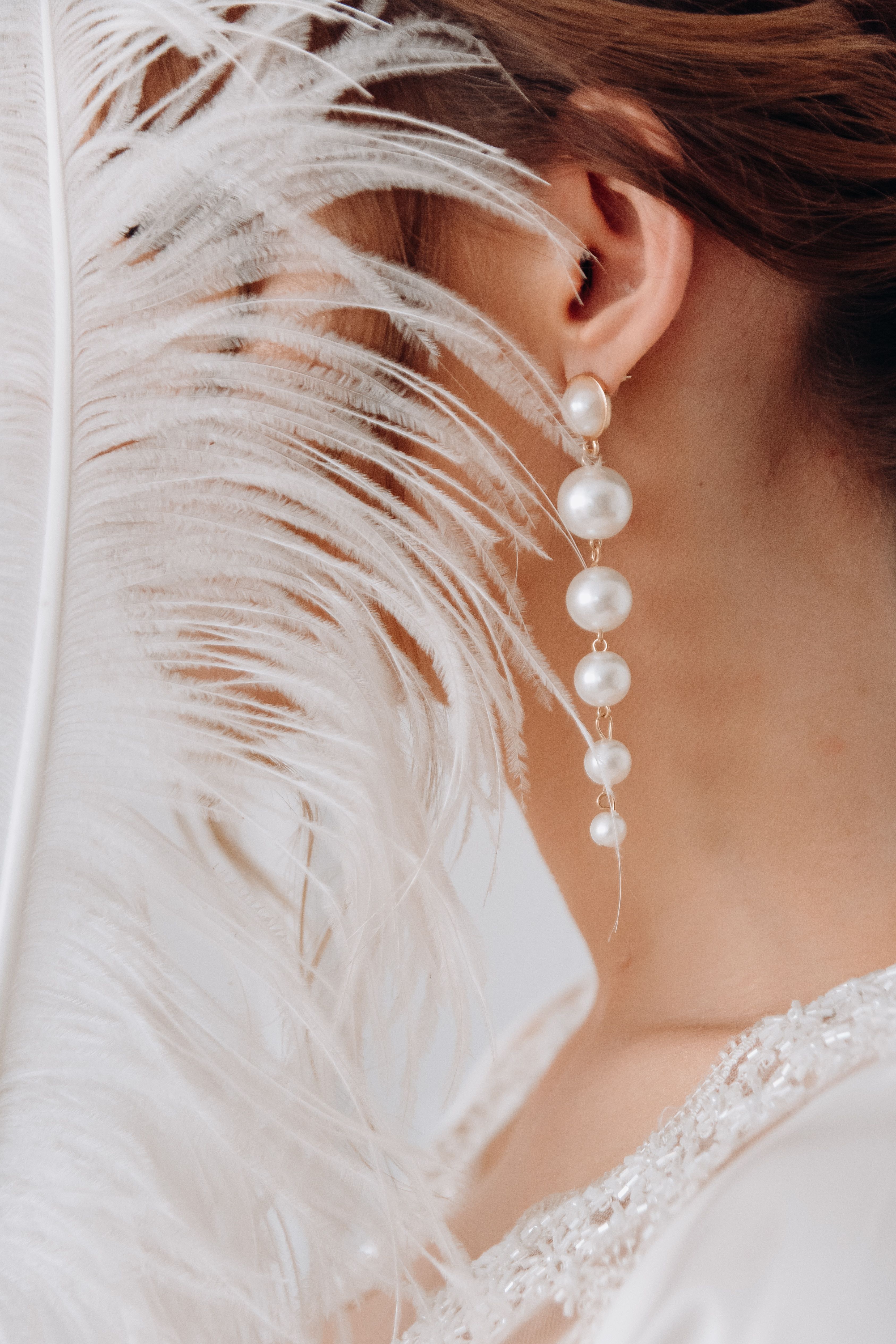 A Woman Wearing a Pearl Necklace · Free Stock Photo