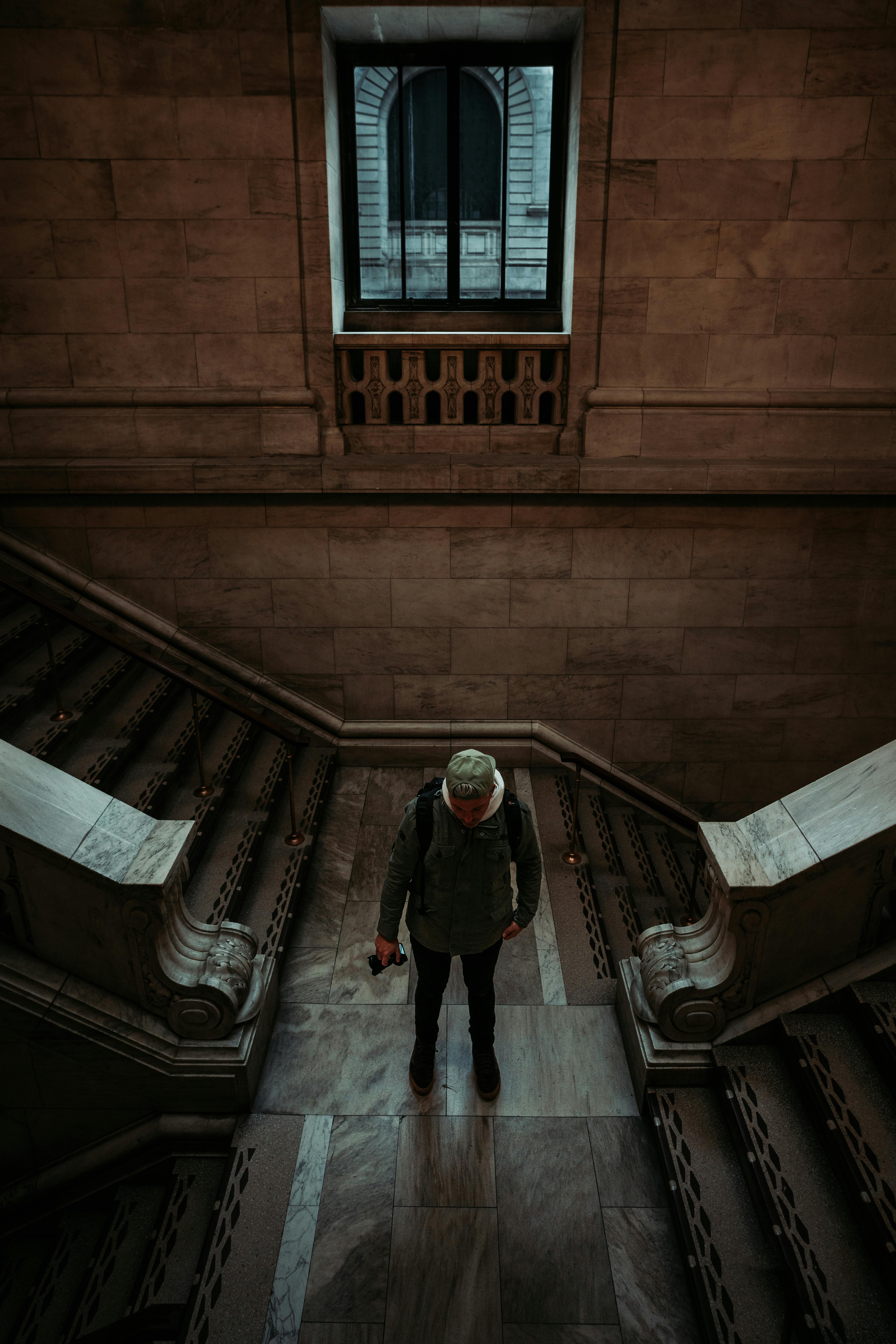 Person Standing between Stairs · Free Stock Photo