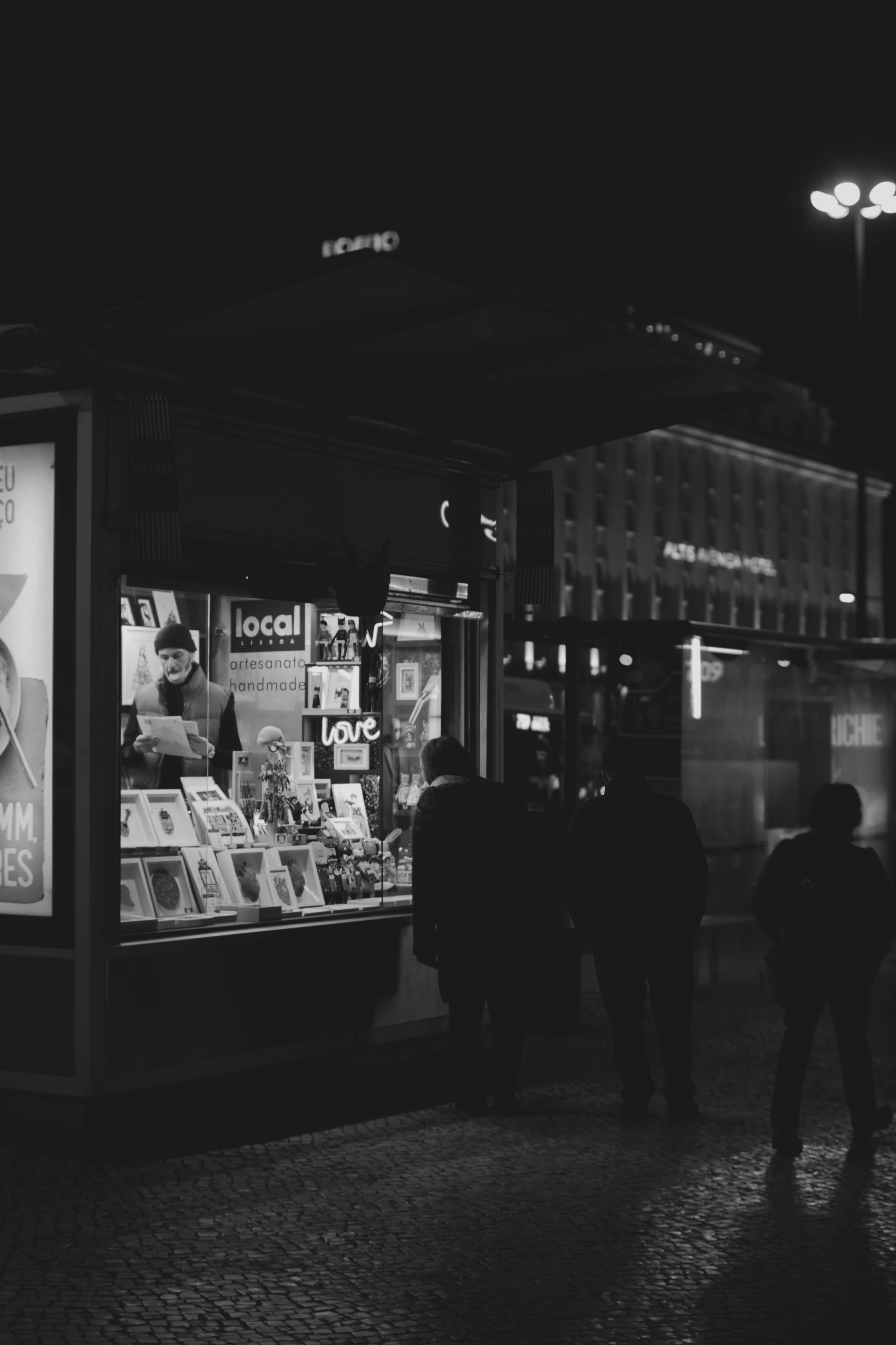 People Standing near Booth at Night · Free Stock Photo
