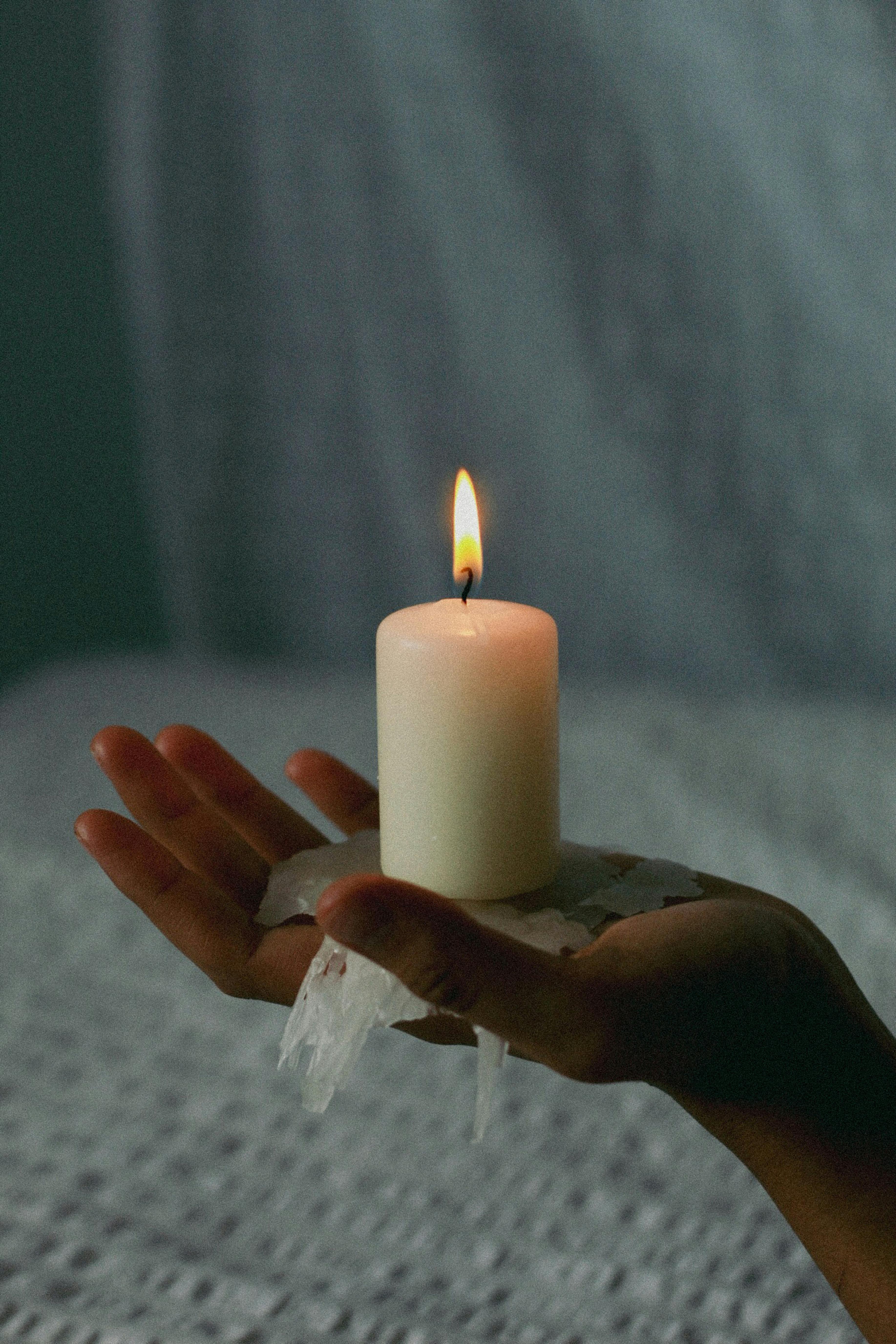 Woman Holding a Burning Candle in her Hand · Free Stock Photo
