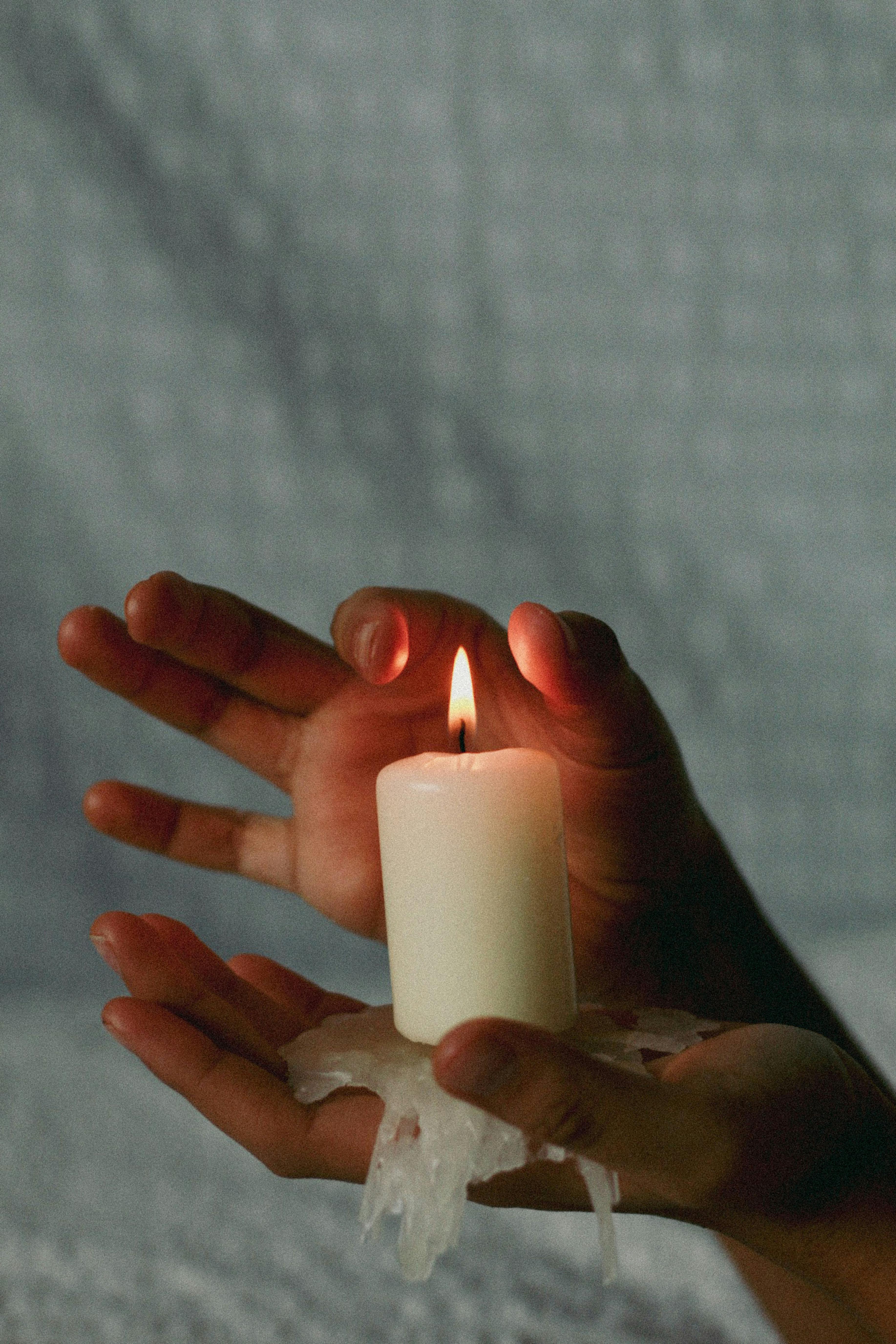 Hands Holding Melting Candle · Free Stock Photo