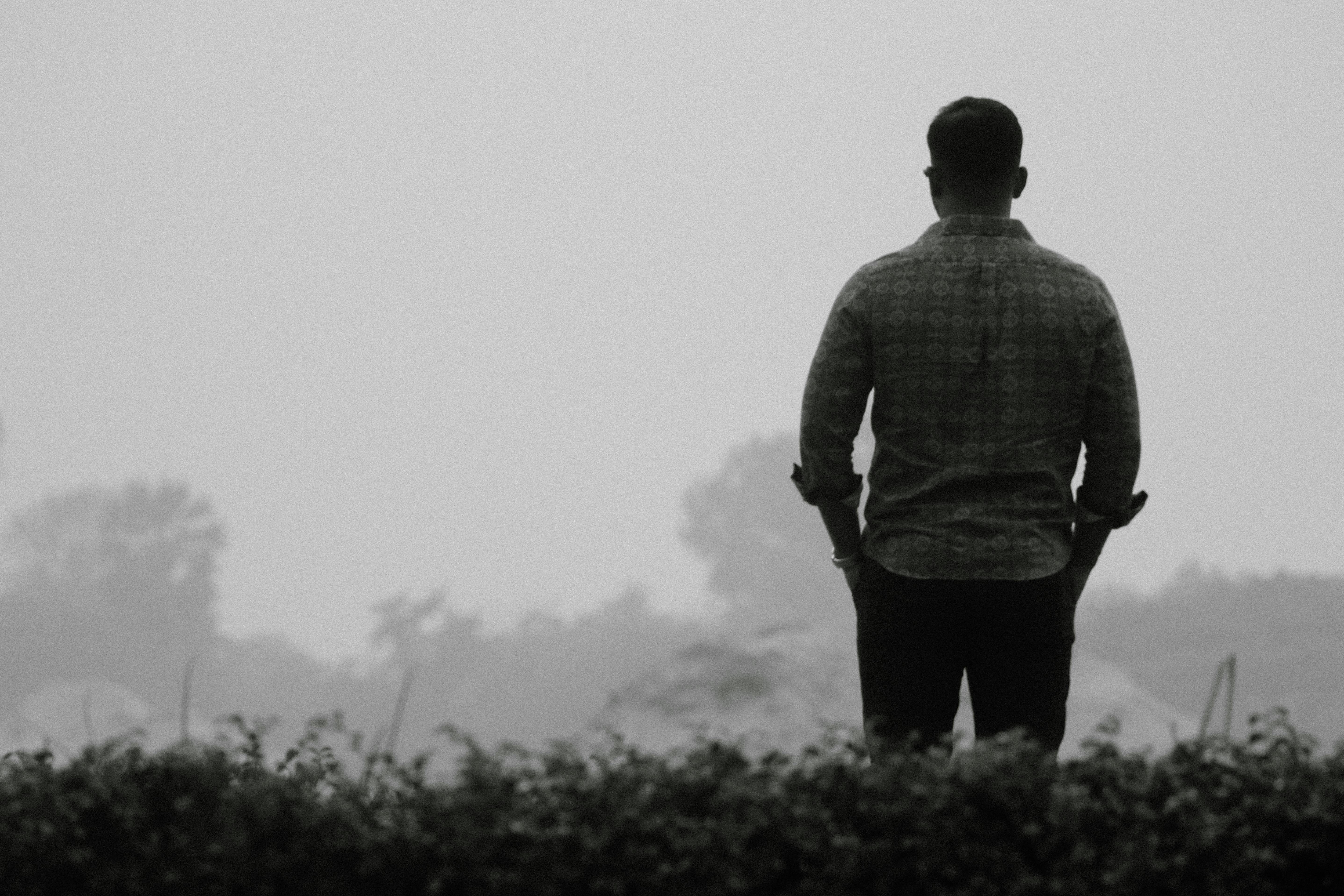 Depressed man standing alone · Free Stock Photo