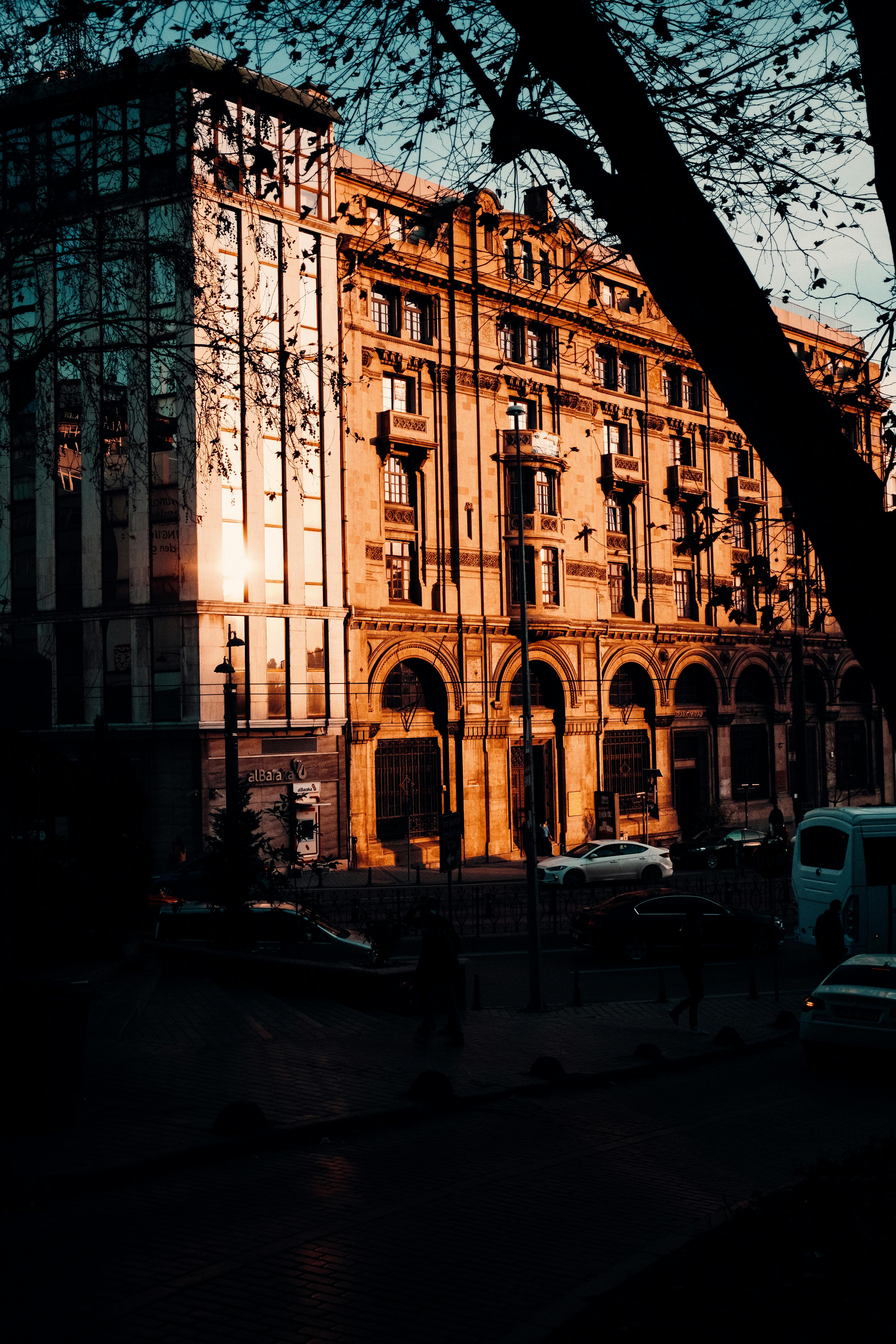 Sunlit Building behind Street in Shadow · Free Stock Photo