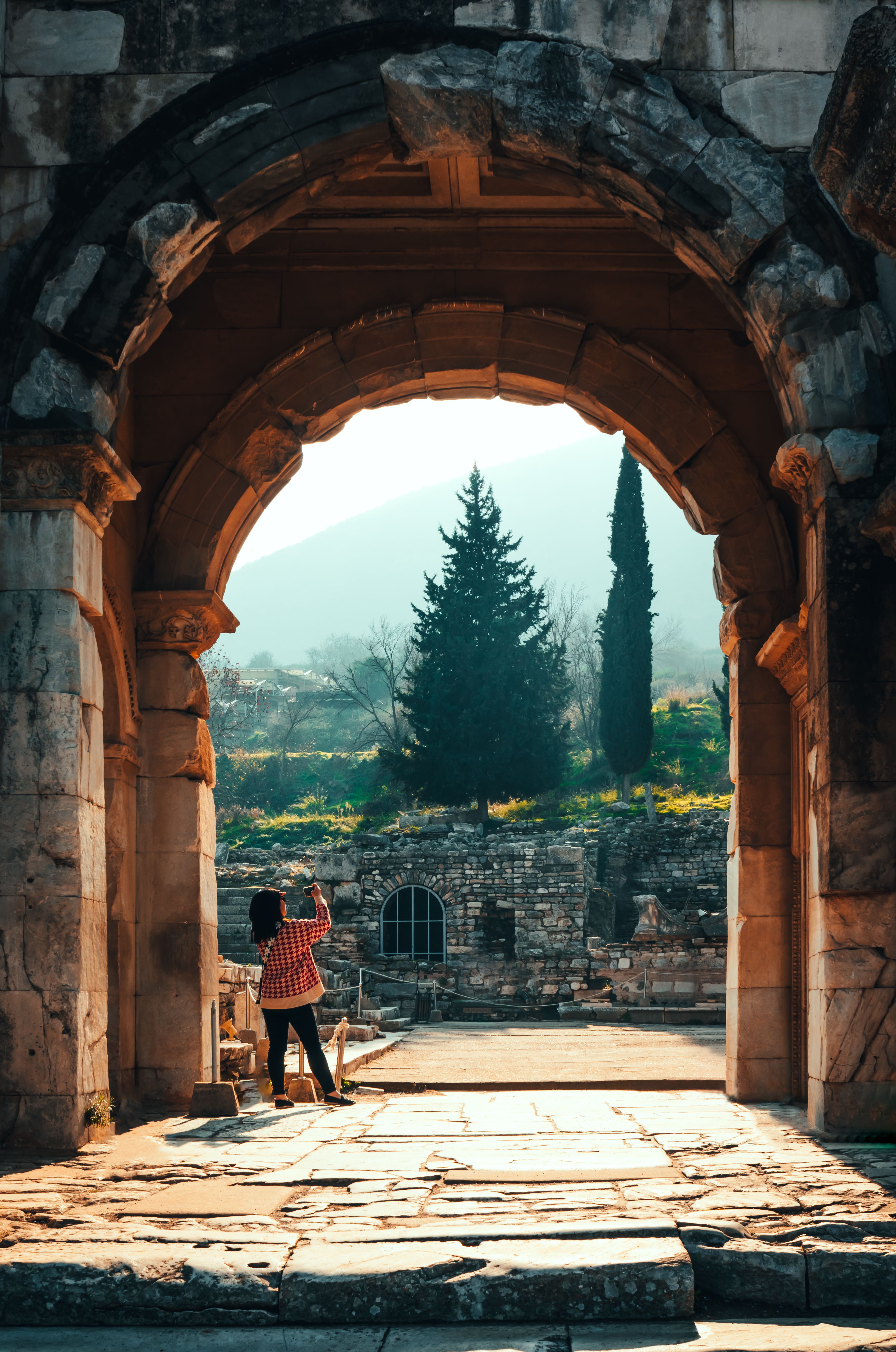 Woman under Stone Arch · Free Stock Photo