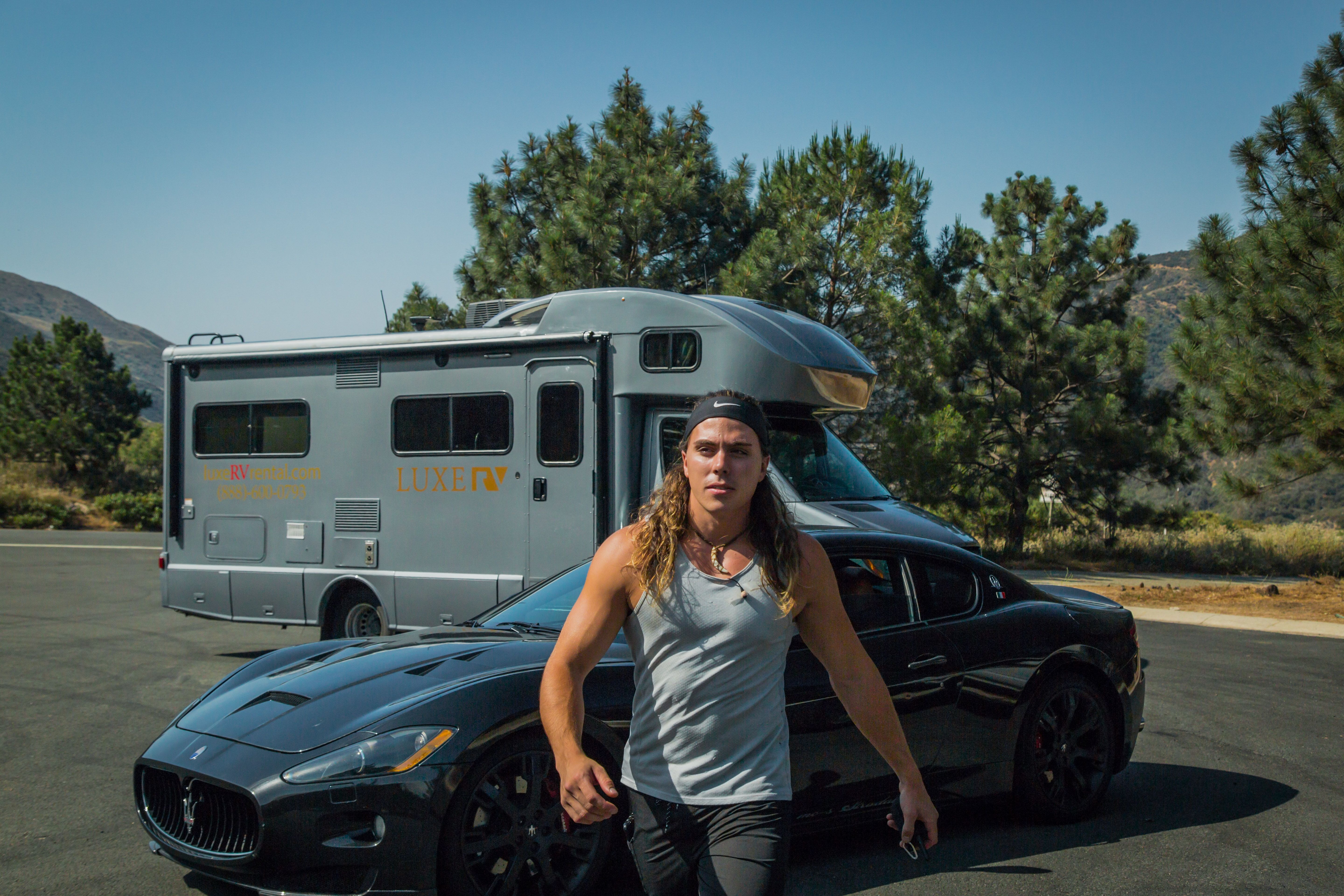 Maserati Gran Turismo and RV behind · Free Stock Photo