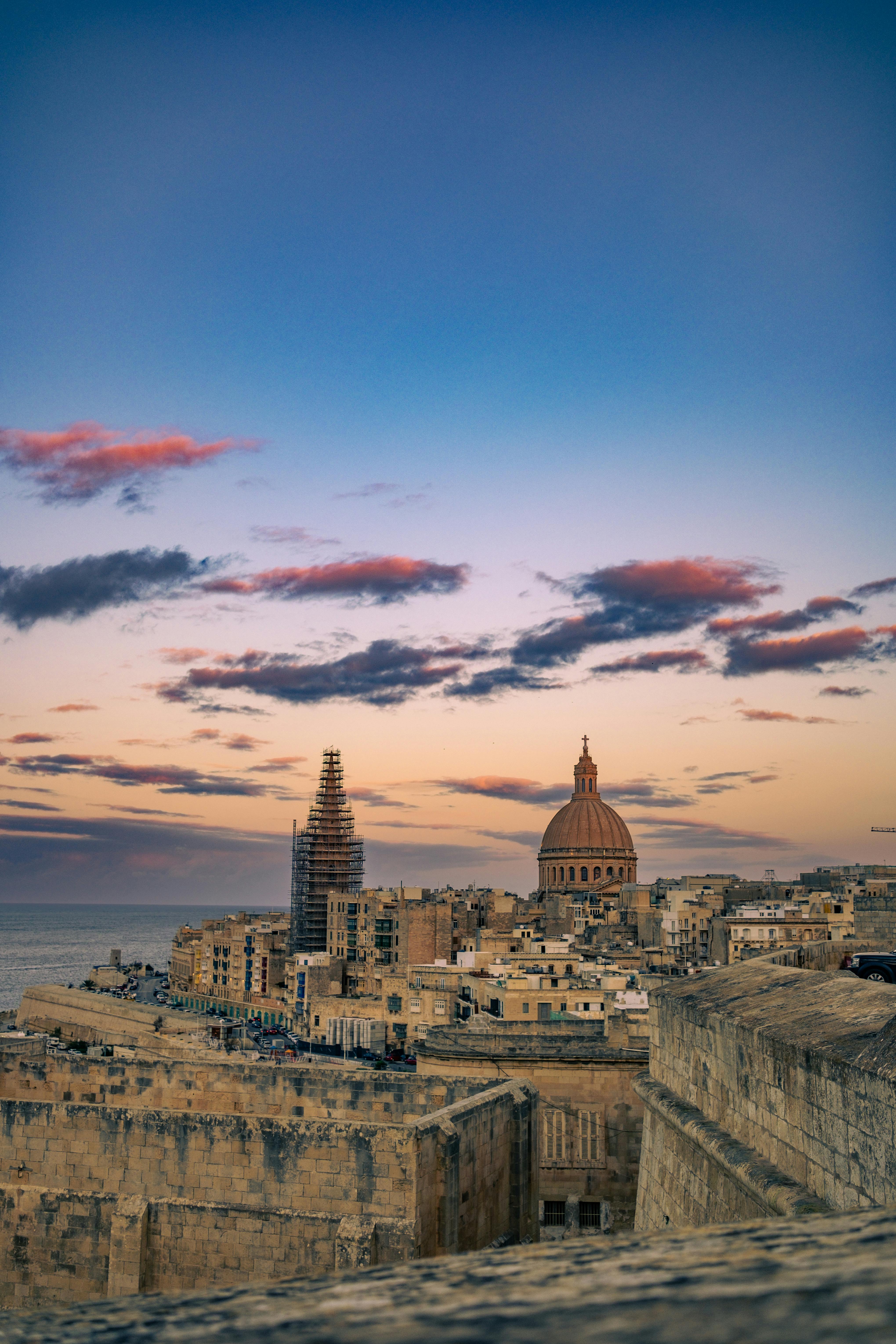 Clouds over Town with Cathedral Dome at Sunset · Free Stock Photo