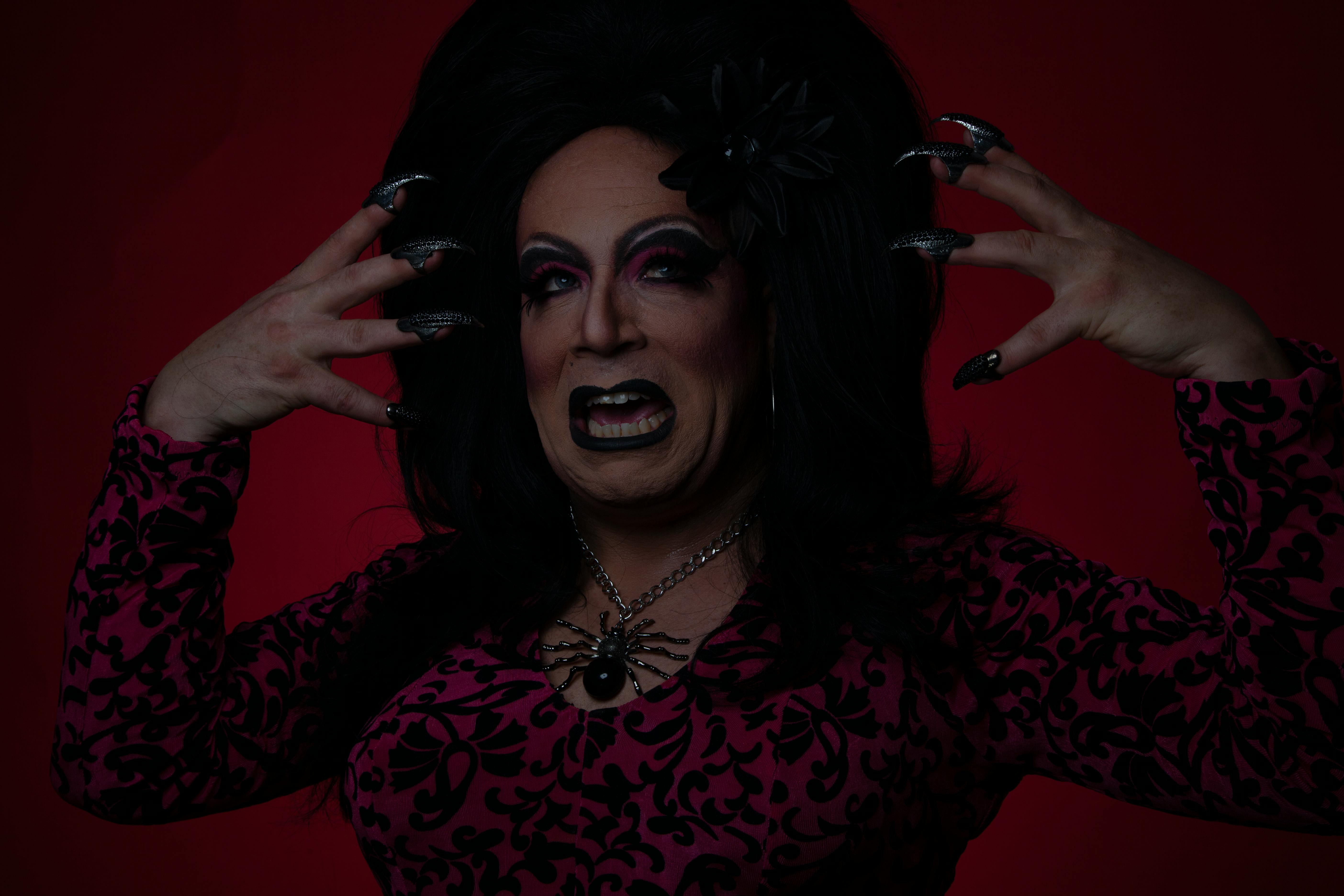 Drag Queen Posing in Red Dress on Stairs of Castle · Free Stock Photo