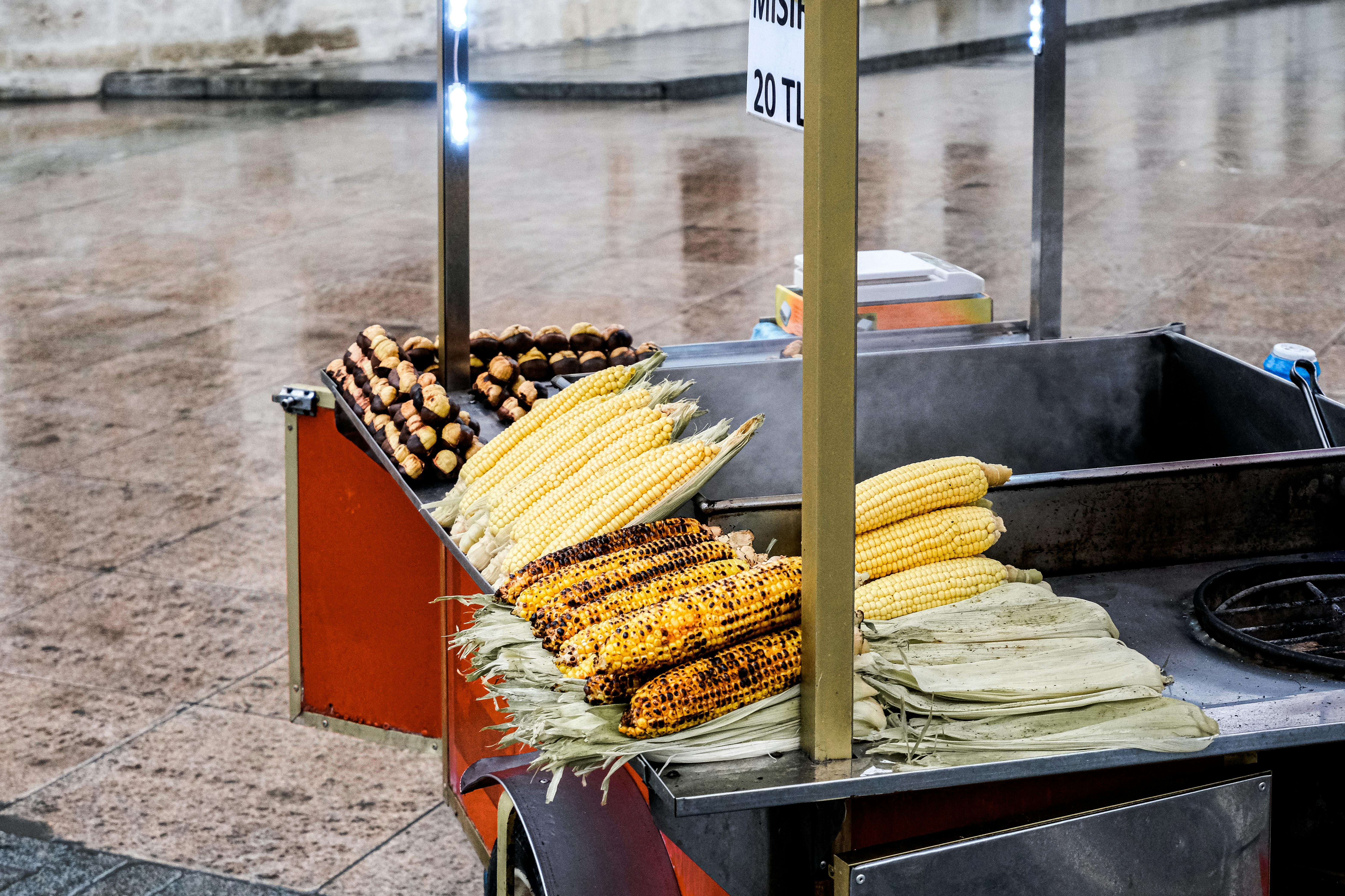 Photo of a Food Cart with Corn and Chestnuts · Free Stock Photo