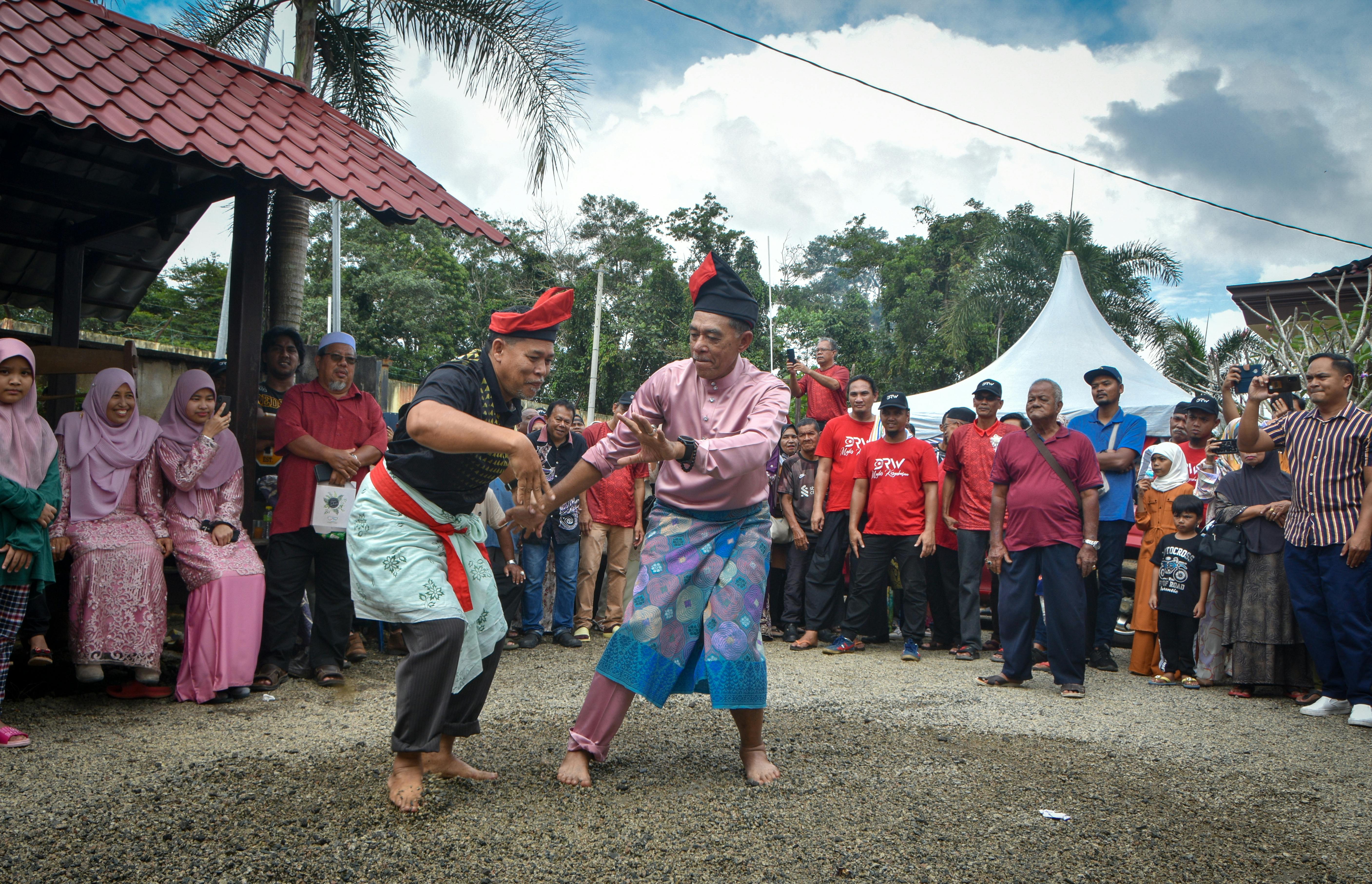 Men Dancing on Green Grass · Free Stock Photo