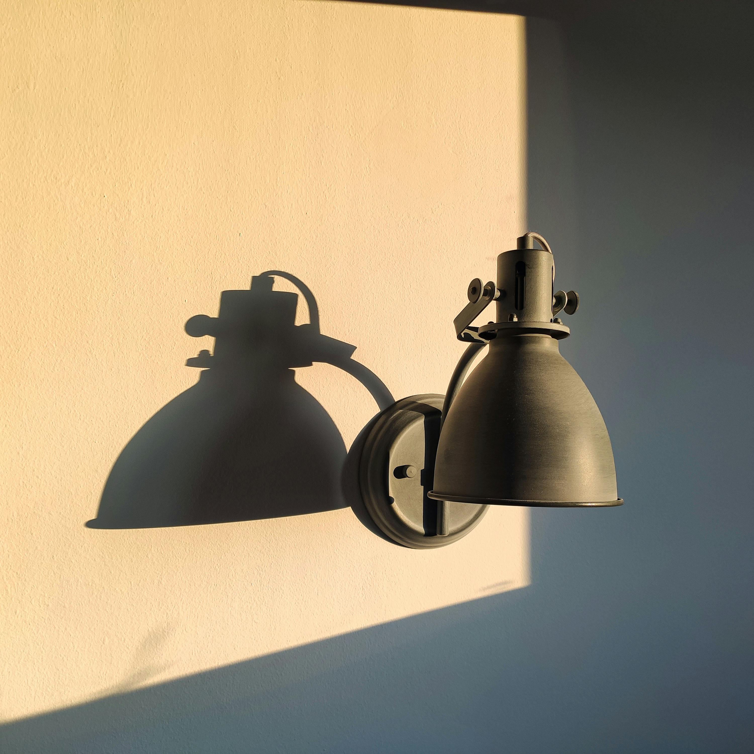 Lamp Shadow on Sunlit Wall · Free Stock Photo