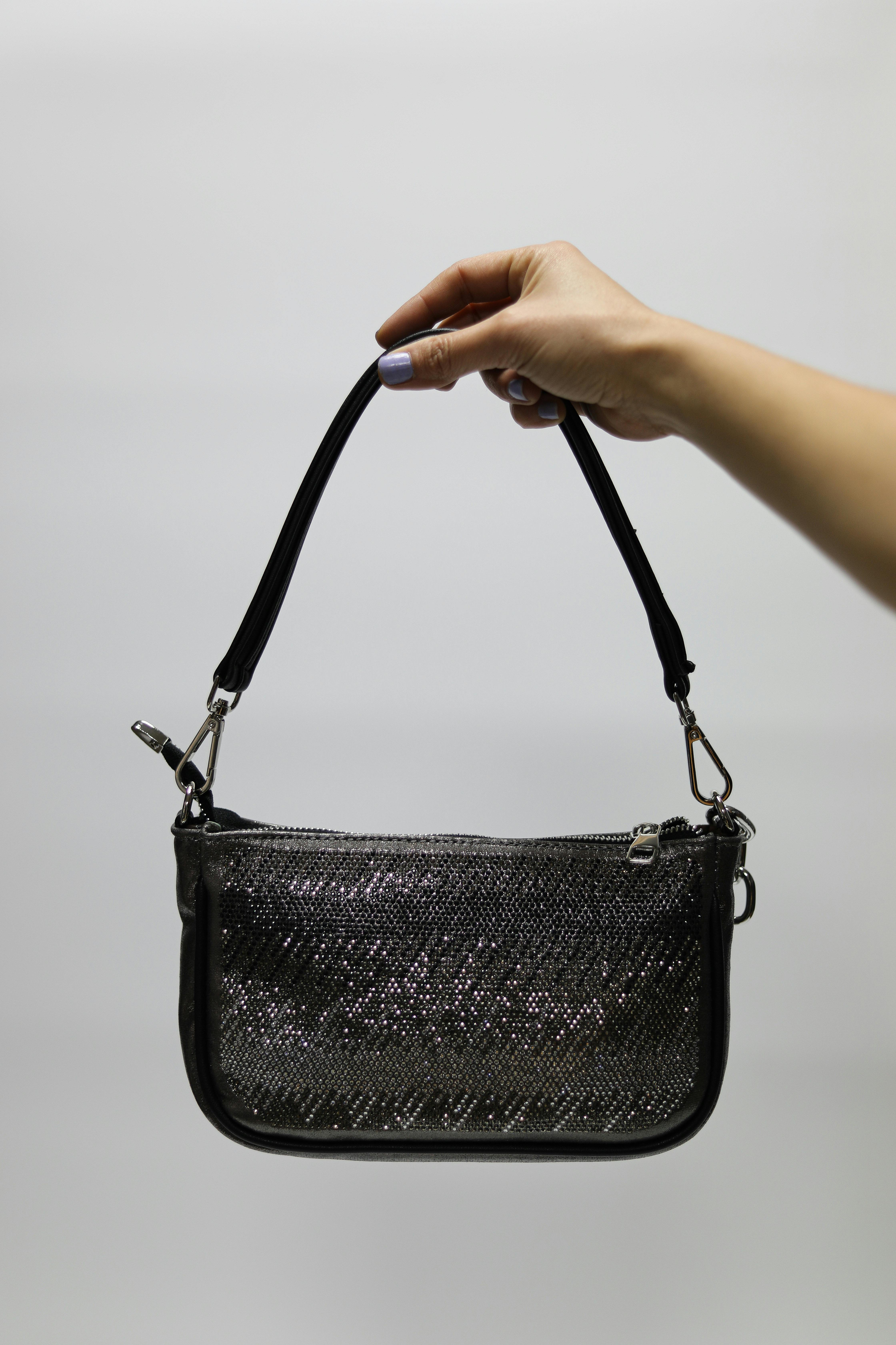 Woman Hand Holding Bag · Free Stock Photo